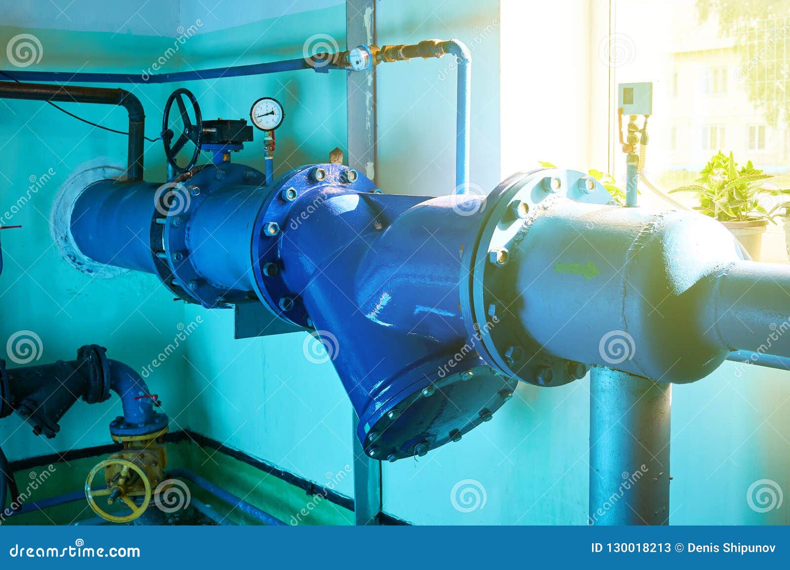 Valves Installed on Tubes Painted Blue. Industrial Background. Stock ...