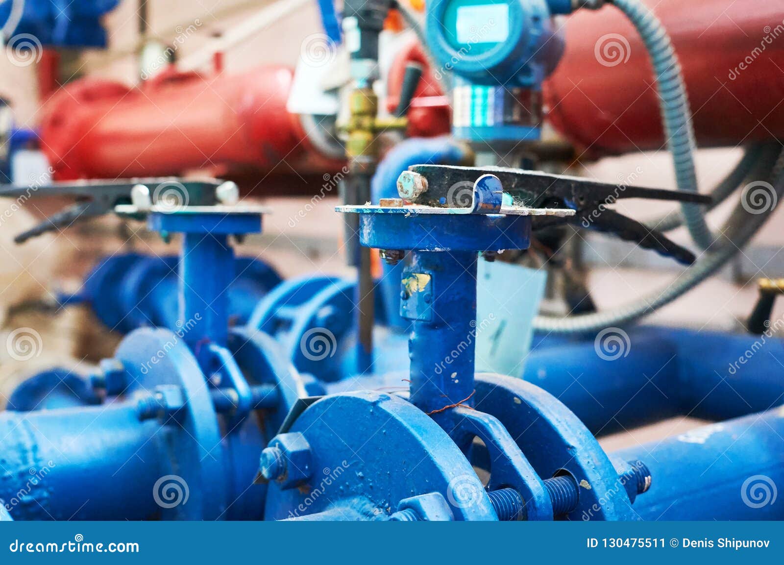 Valves Installed on Tubes Painted Blue. Industrial Background. Stock ...