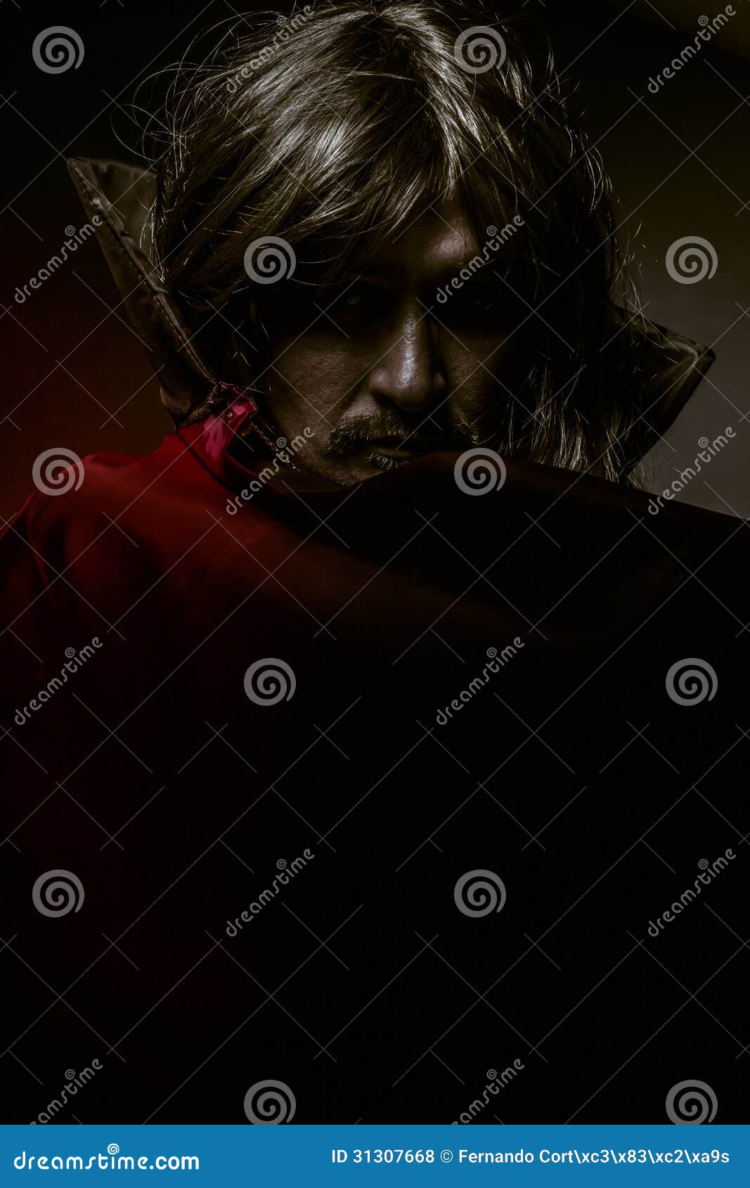 Vampire with Red Coat and Long Hair, Halloween Stock Photo - Image of ...
