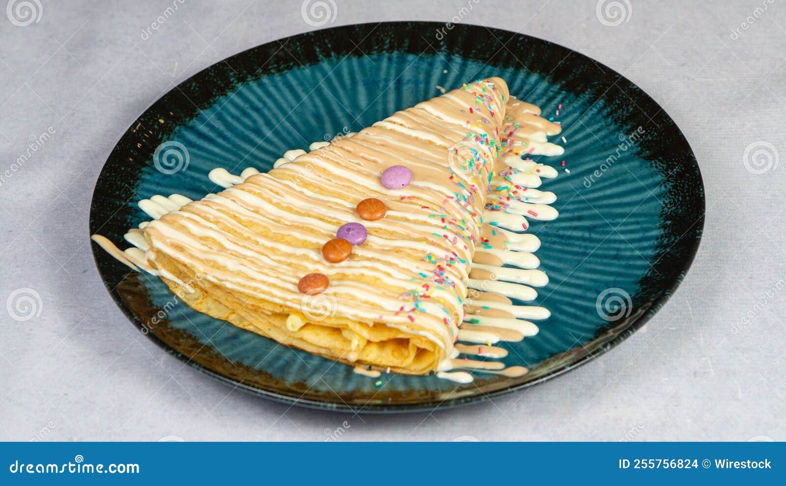 Vanilla crepe on a plate stock photo. Image of dessert - 255756824