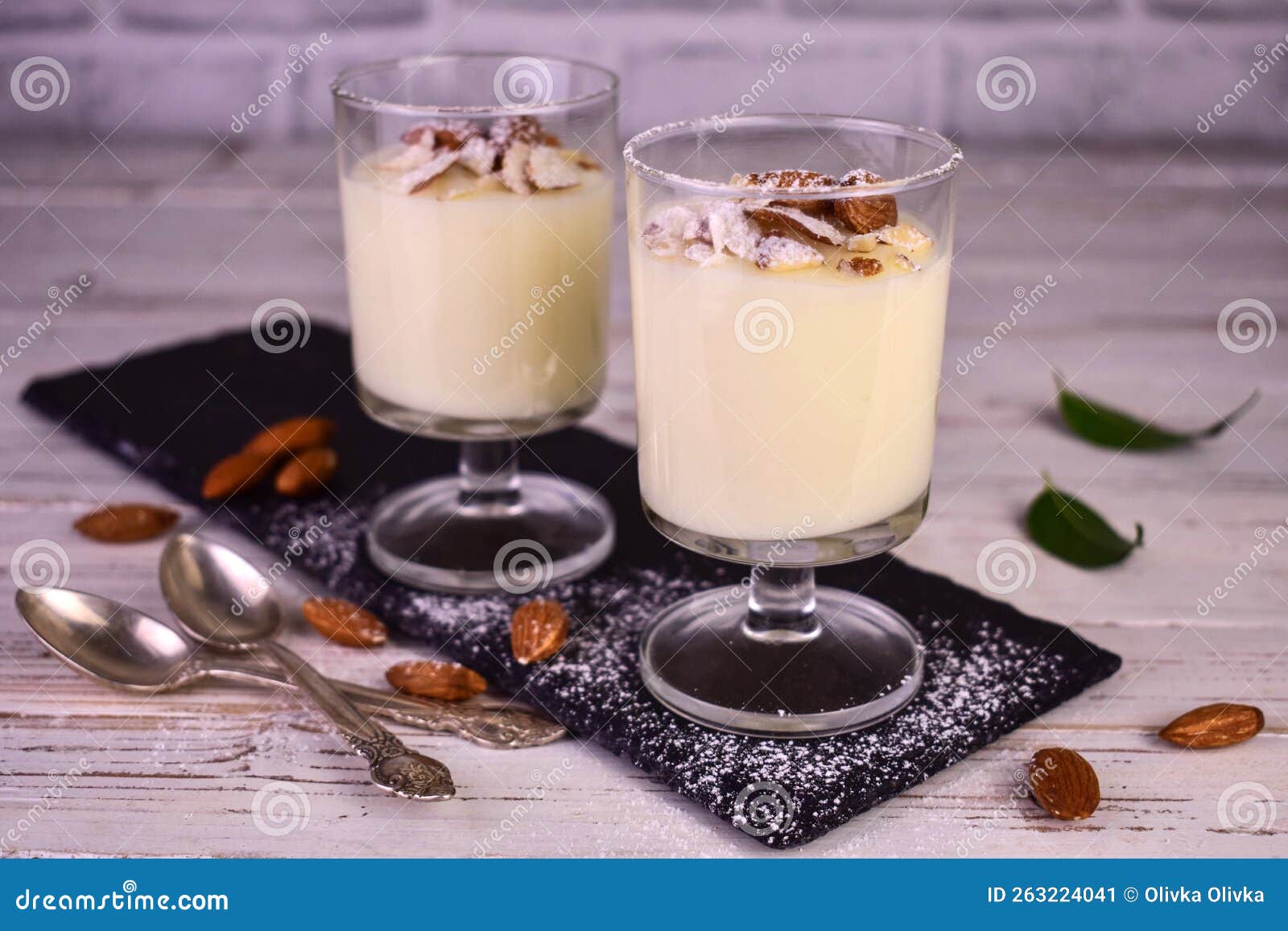 Vanilla Mousse or Pudding with Almonds and Powdered Sugar. Stock Image ...