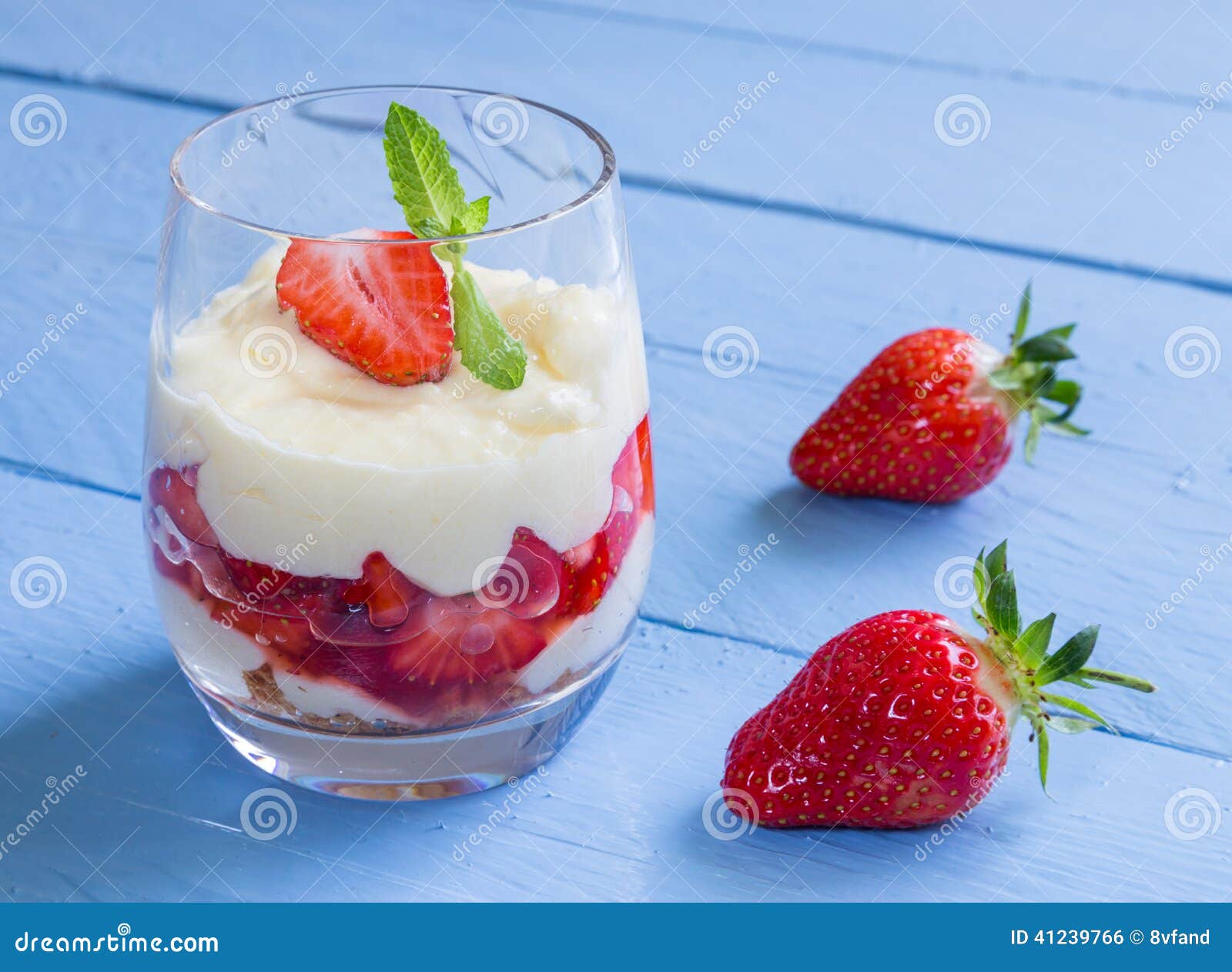 Vanilla Pudding with Tipsy Strawberries on Wood Stock Photo - Image of ...