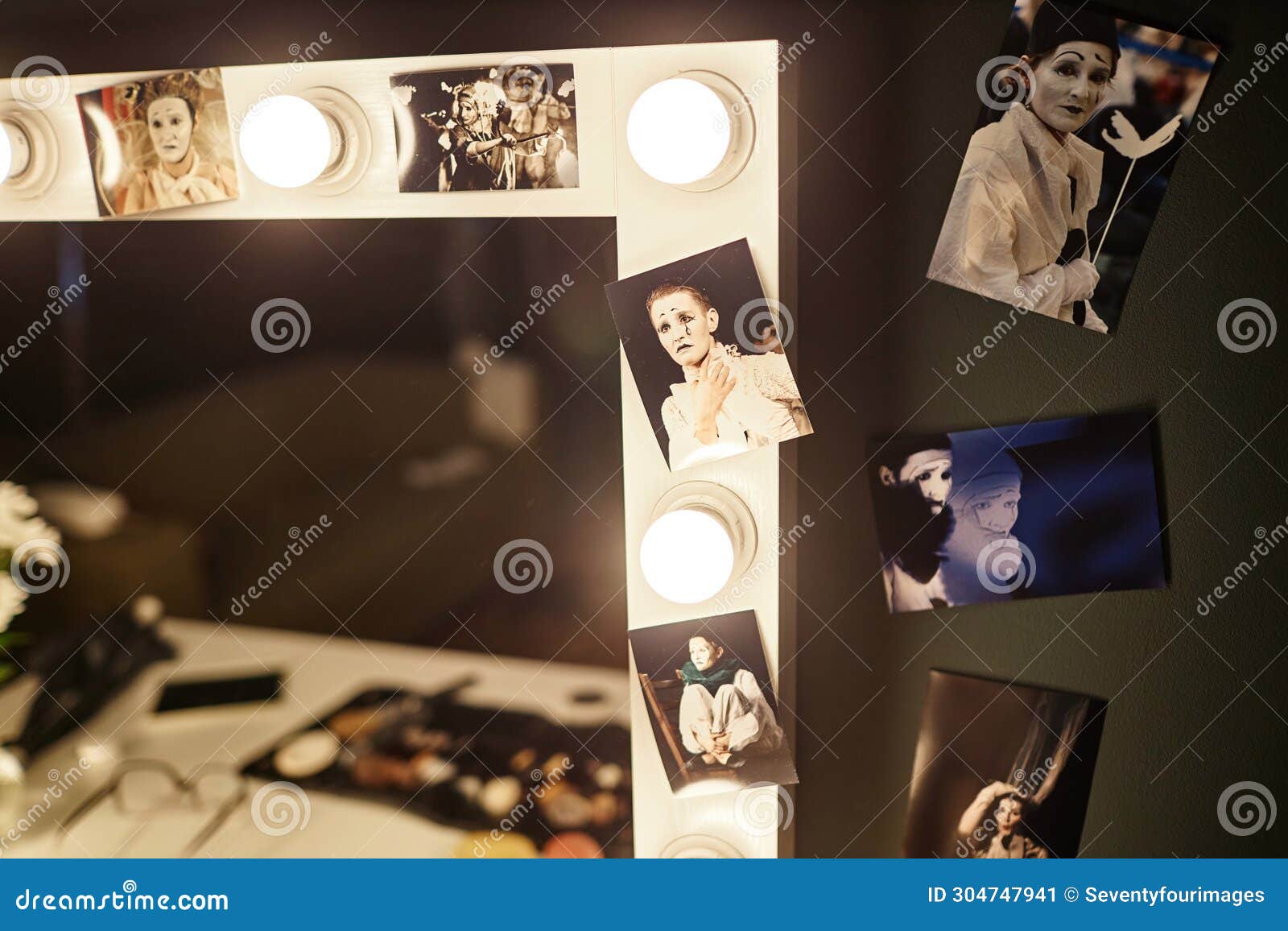 Vanity Table with Assorted Pictures on Mirror Stock Image - Image of ...