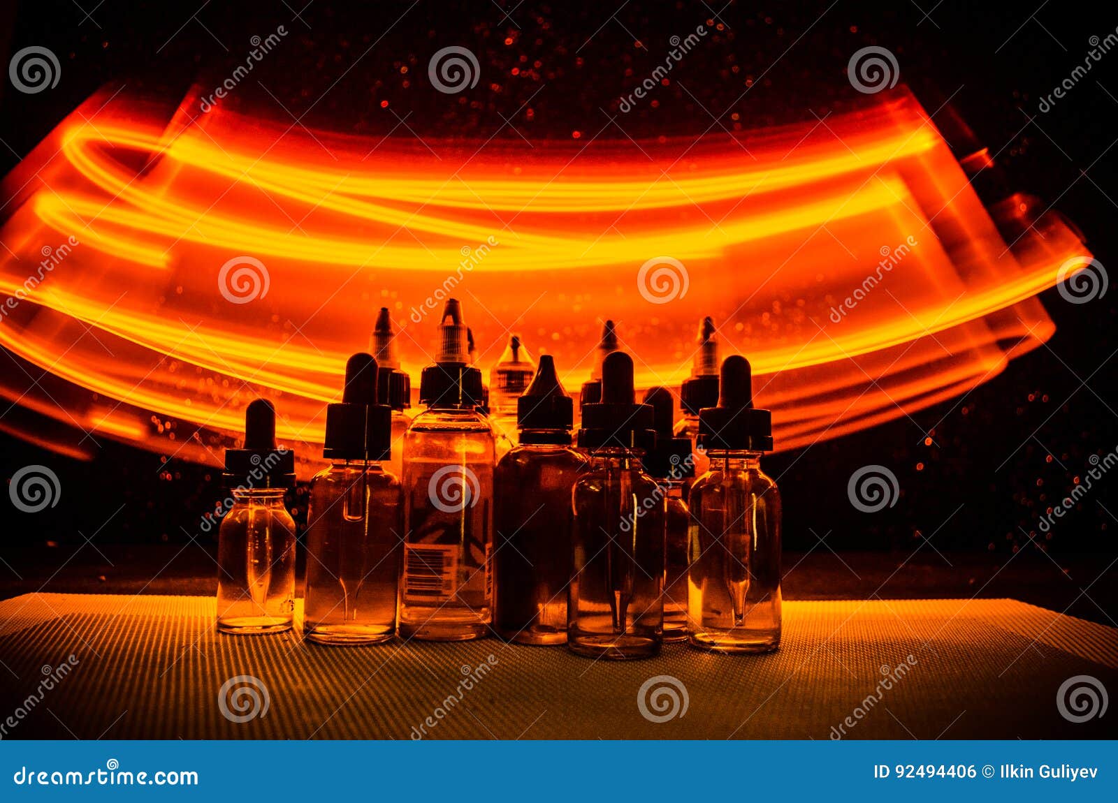 Vape Concept. Smoke Clouds and Vape Liquid Bottles on Dark Background ...