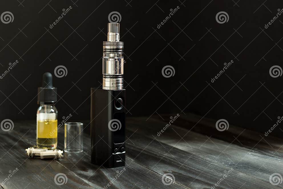 Vape or E-cigarette. Vaping Set on the Table. Stock Photo - Image of ...