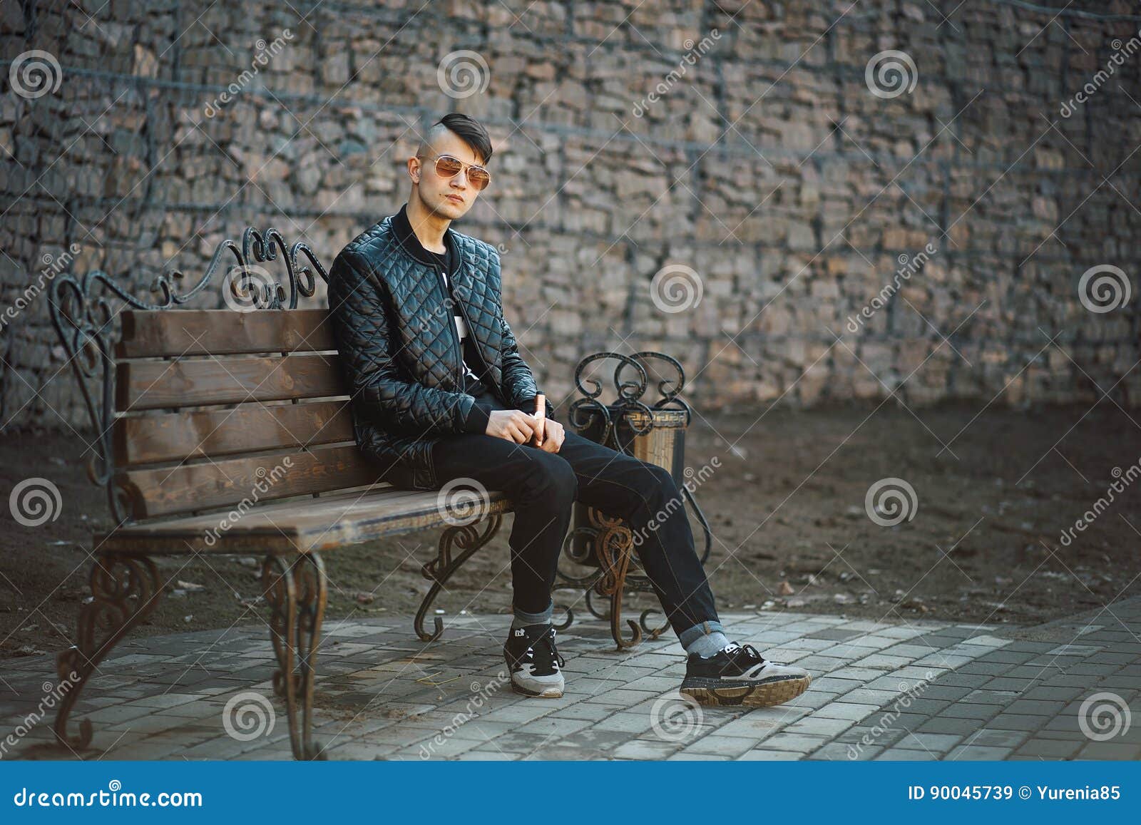 Vape. a Young Handsome Guy Sits with an Electronic Cigarette on the ...