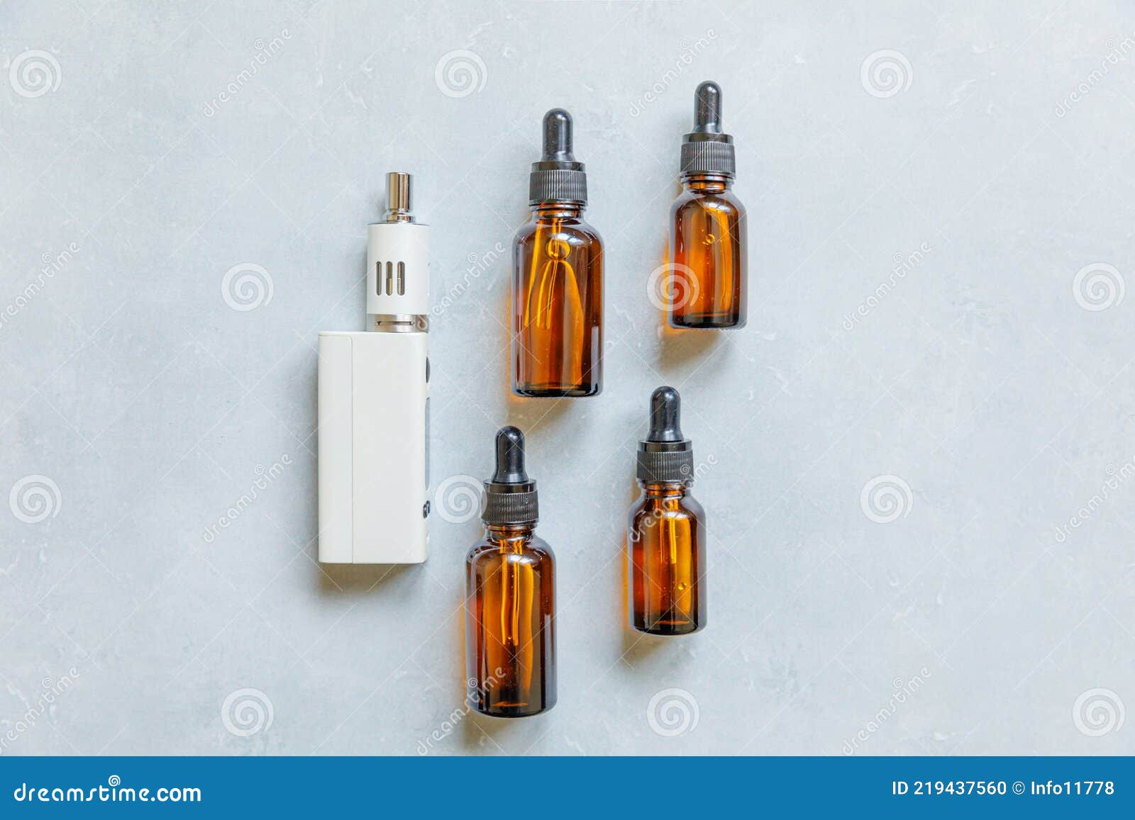 Vaping Device E-cigarette Electronic Cigarette and Liquid Bottles on ...