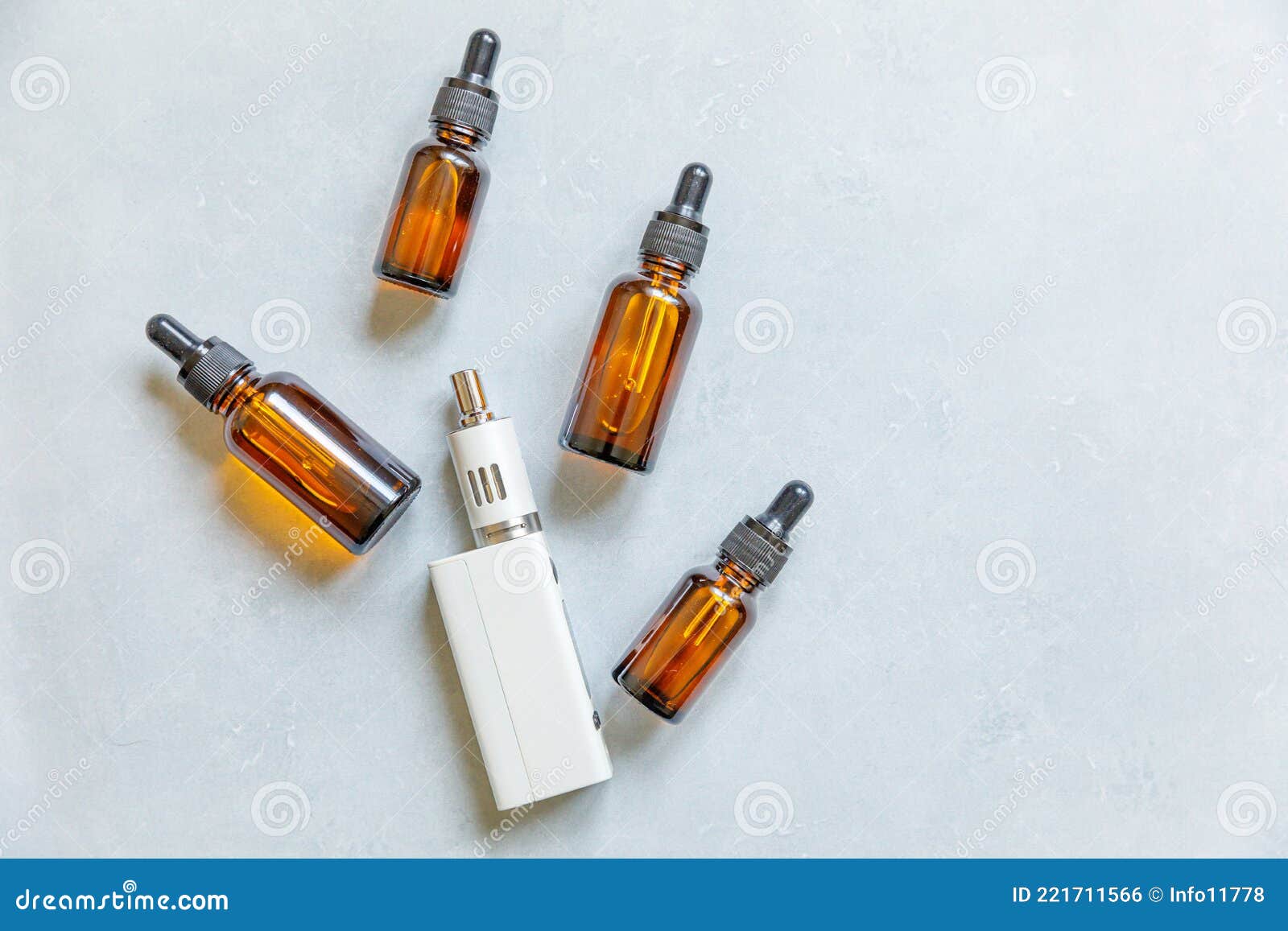 Vaping Device E-cigarette Electronic Cigarette and Liquid Bottles on ...