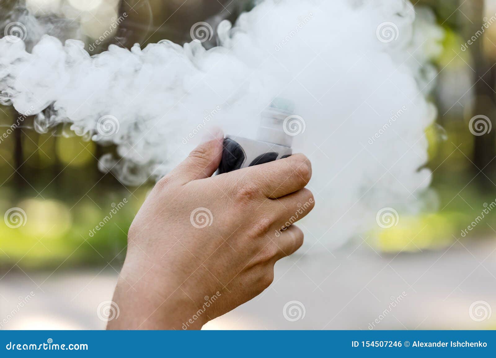 Vaping Device in the Hand with Smoke Stock Photo - Image of liquid ...