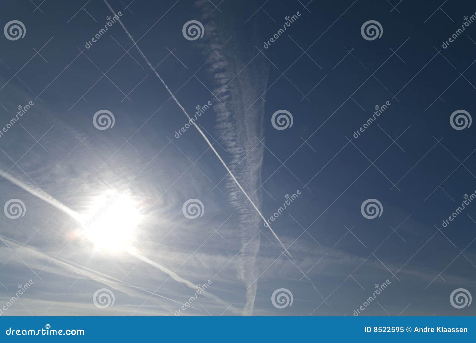 Vapour trails in sunny sky stock image. Image of contrails - 8522595