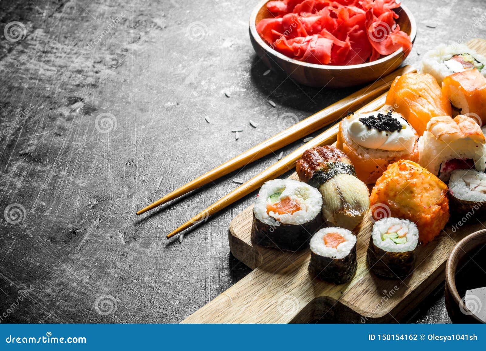 Variants of Types of Sushi, Maki and Rolls on a Cutting Board with ...