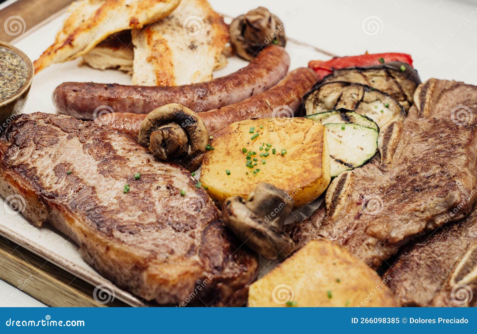 Varied Quality Meat Barbecue with Roasted Potato Stock Image - Image of ...