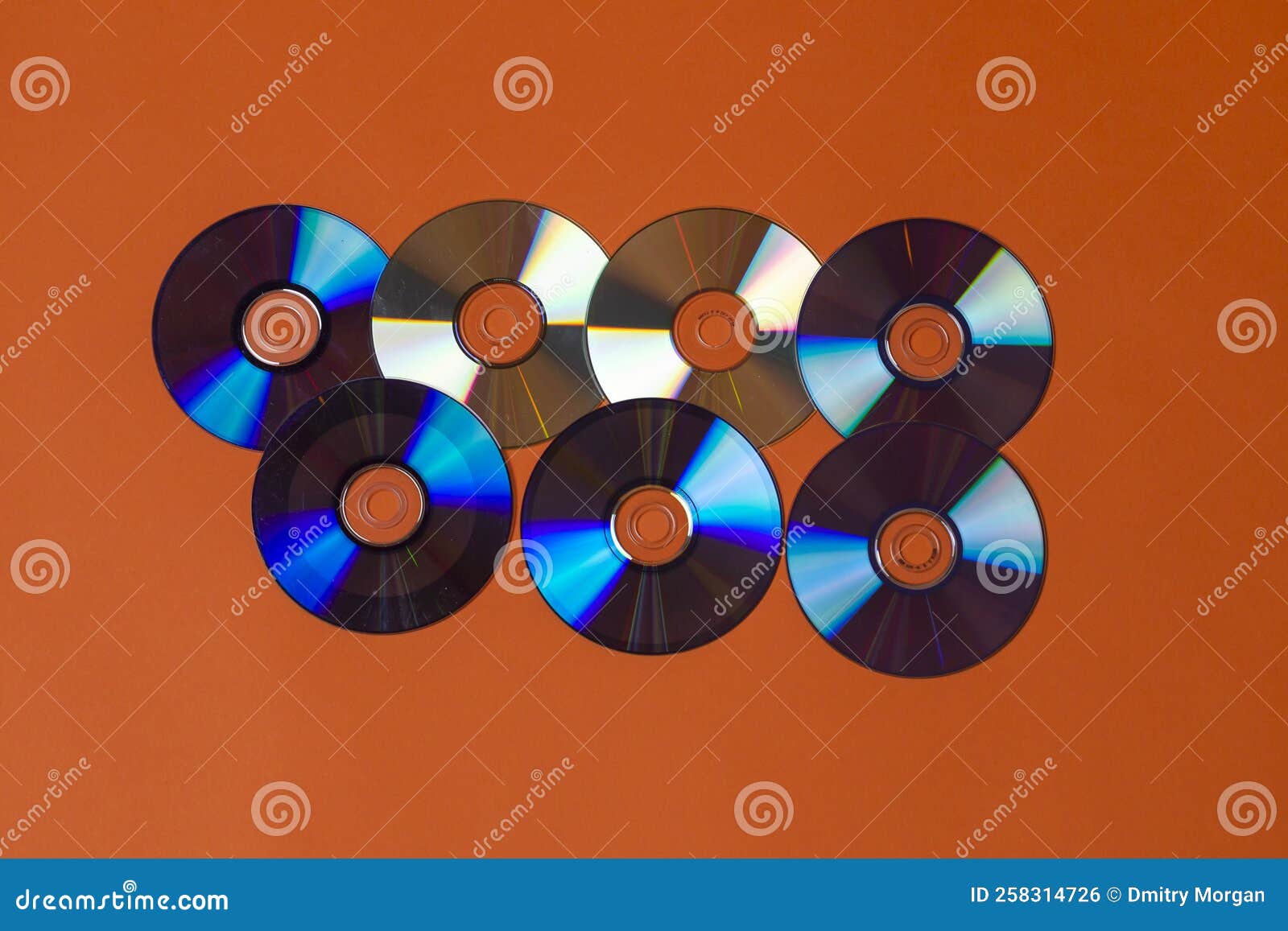Variety of Arranged CD Disks or DVD Disks on Orange Background Stock ...
