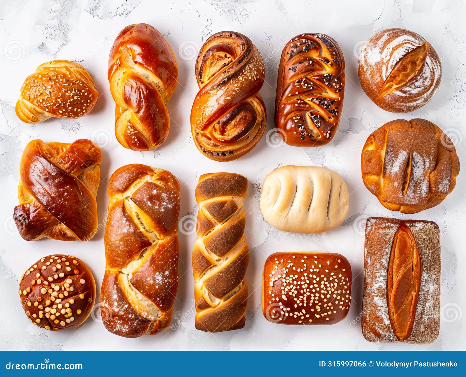 A Variety of Breads and Rolls are Shown on a White Surface Stock Photo ...