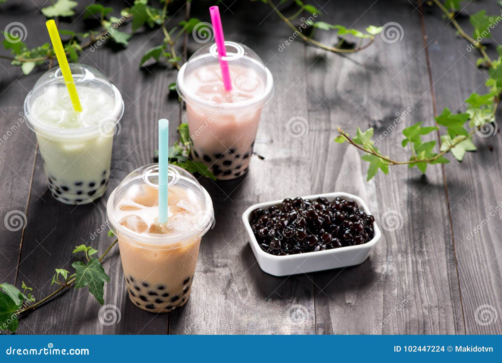 Variety of Bubble Tea in Plastic Cups with Straws on a Wooden Ta Stock ...