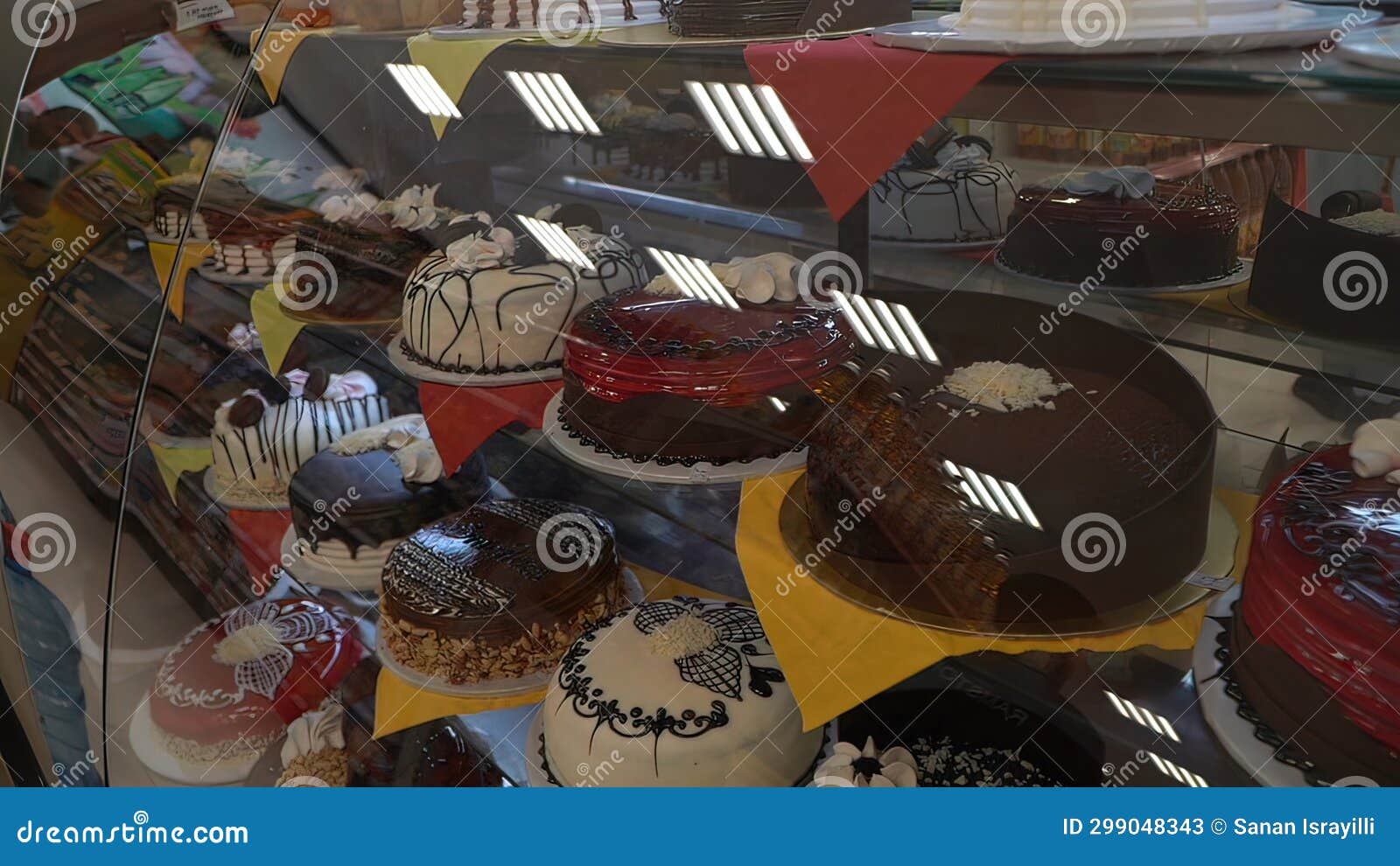 A Variety of Cakes on Display in a Shop Window Stock Image - Image of ...