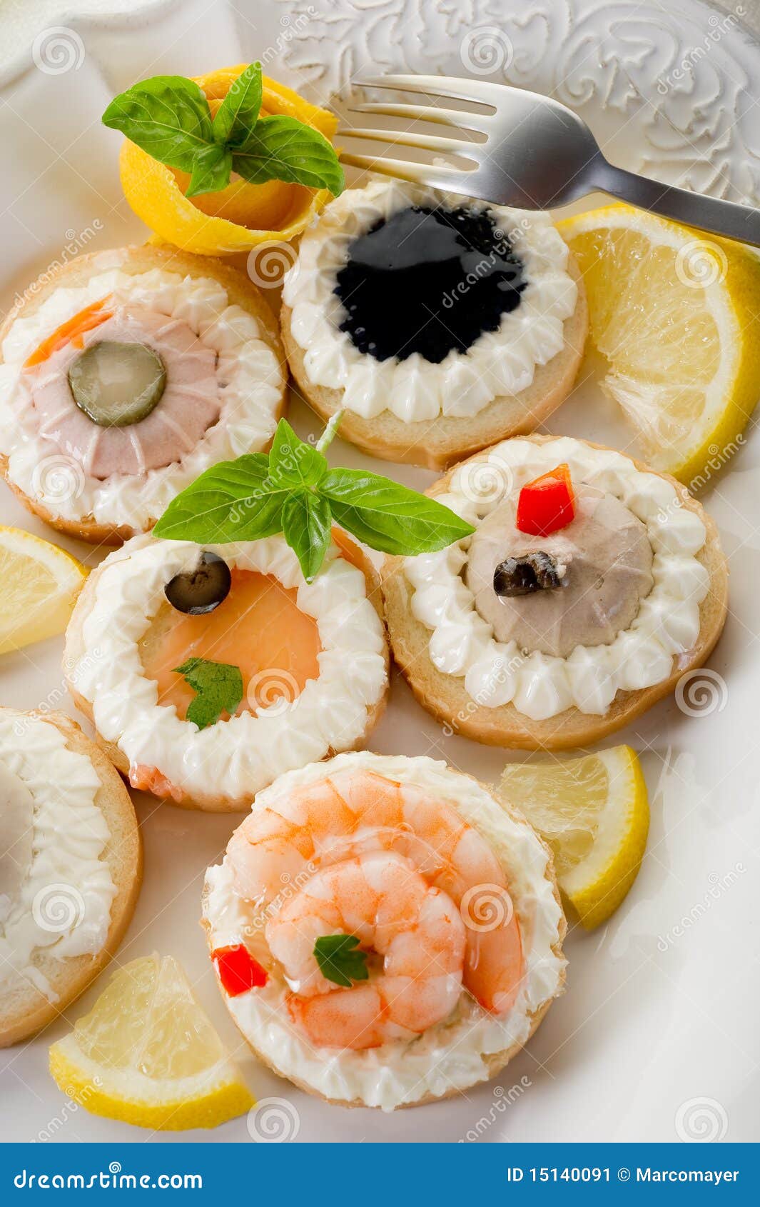Variety of canapes on dish stock image. Image of fork - 15140091