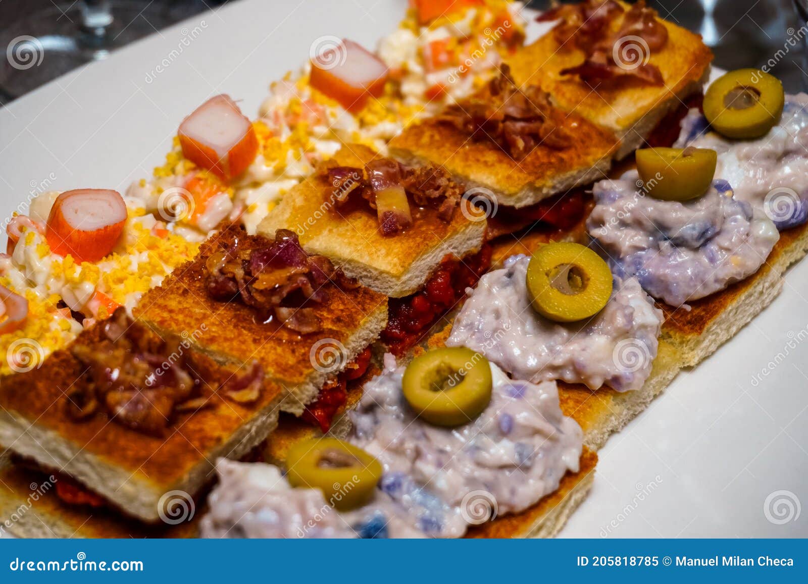 Variety of Canapes with Olives, Mayonnaise, Egg, Pate on a Decorated ...