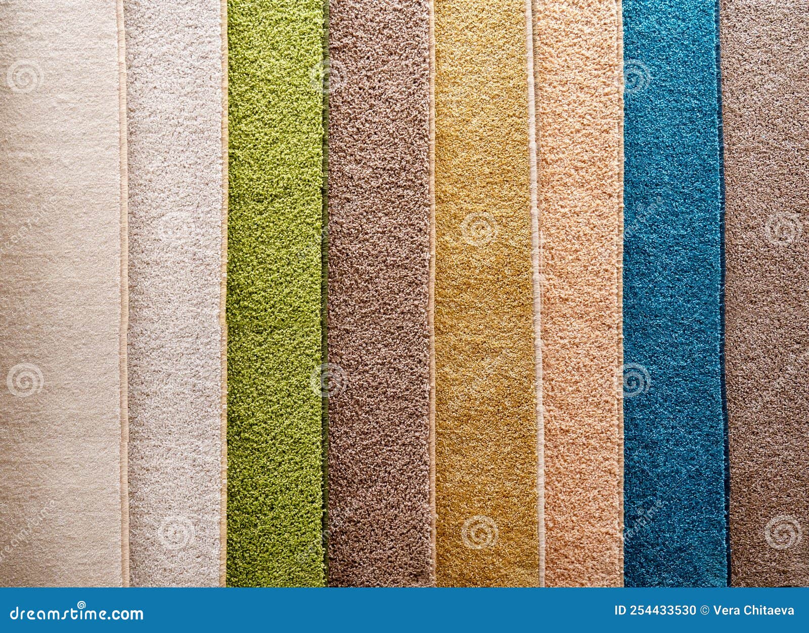 Variety of Carpets and Carpets of Different Colors on the Stand in the ...