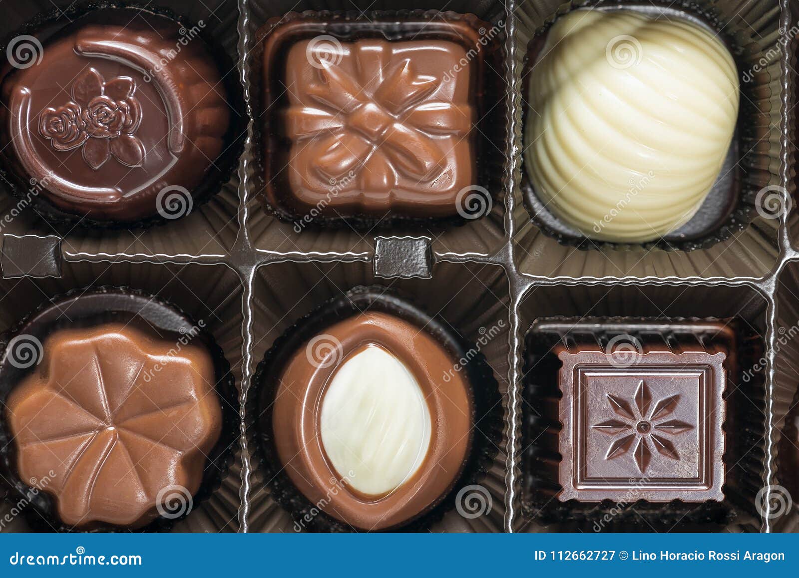 Variety of Chocolates Inside a Black Plastic Box Stock Image - Image of ...