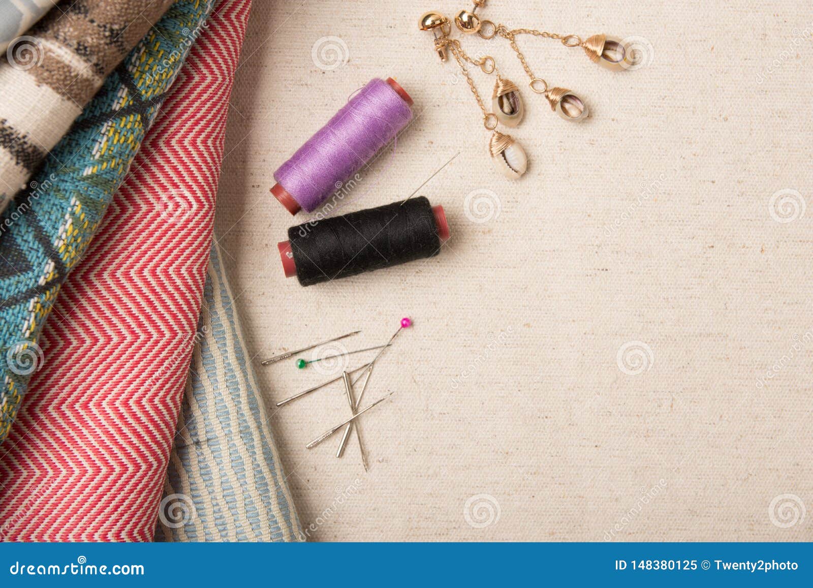 A Variety of Colourful Fabric with Assorted Sewing Pins and Thread Flat ...