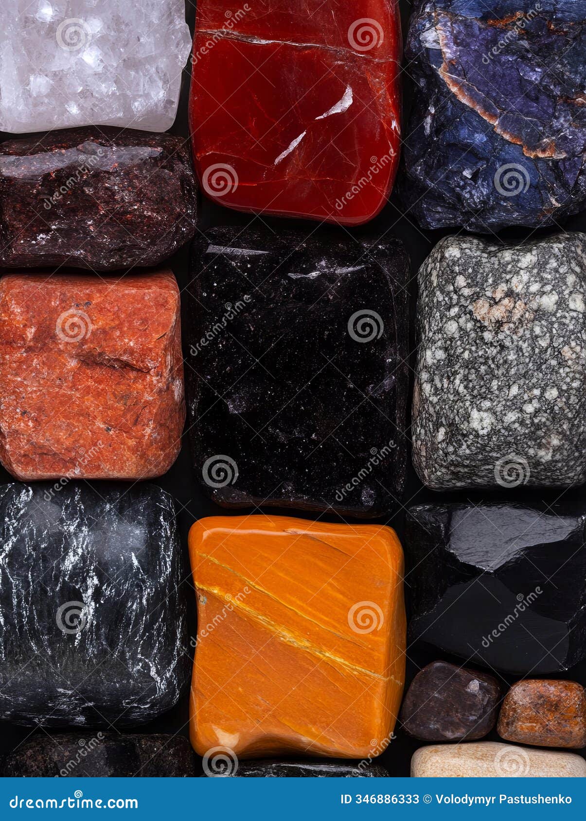 A Variety of Different Colored Rocks on a Black Surface Stock Image ...