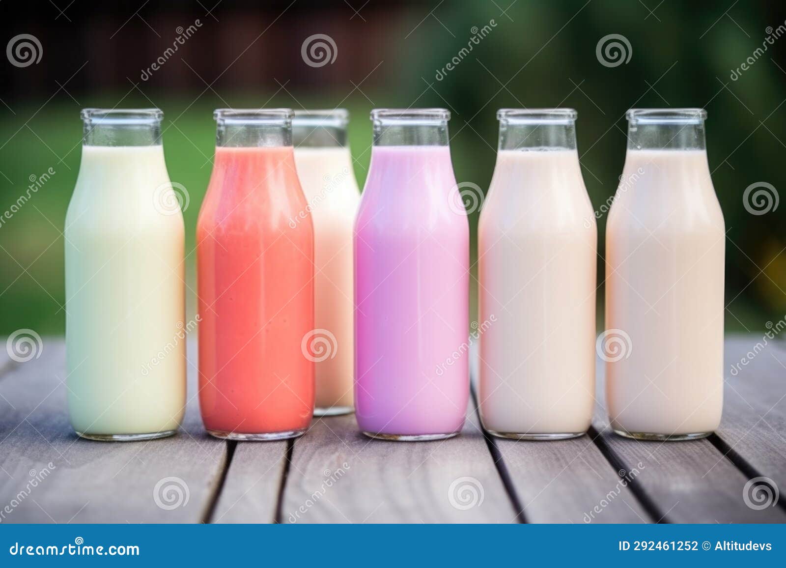 Variety of Flavored Milk Bottles in a Row Stock Photo - Image of milk ...
