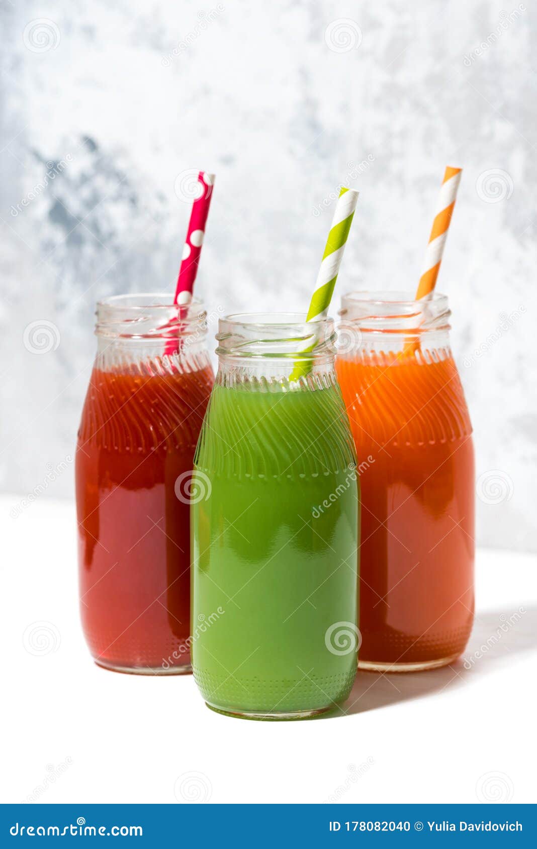 Variety of Fresh Juices in Bottles, Vertical Closeup Stock Photo ...