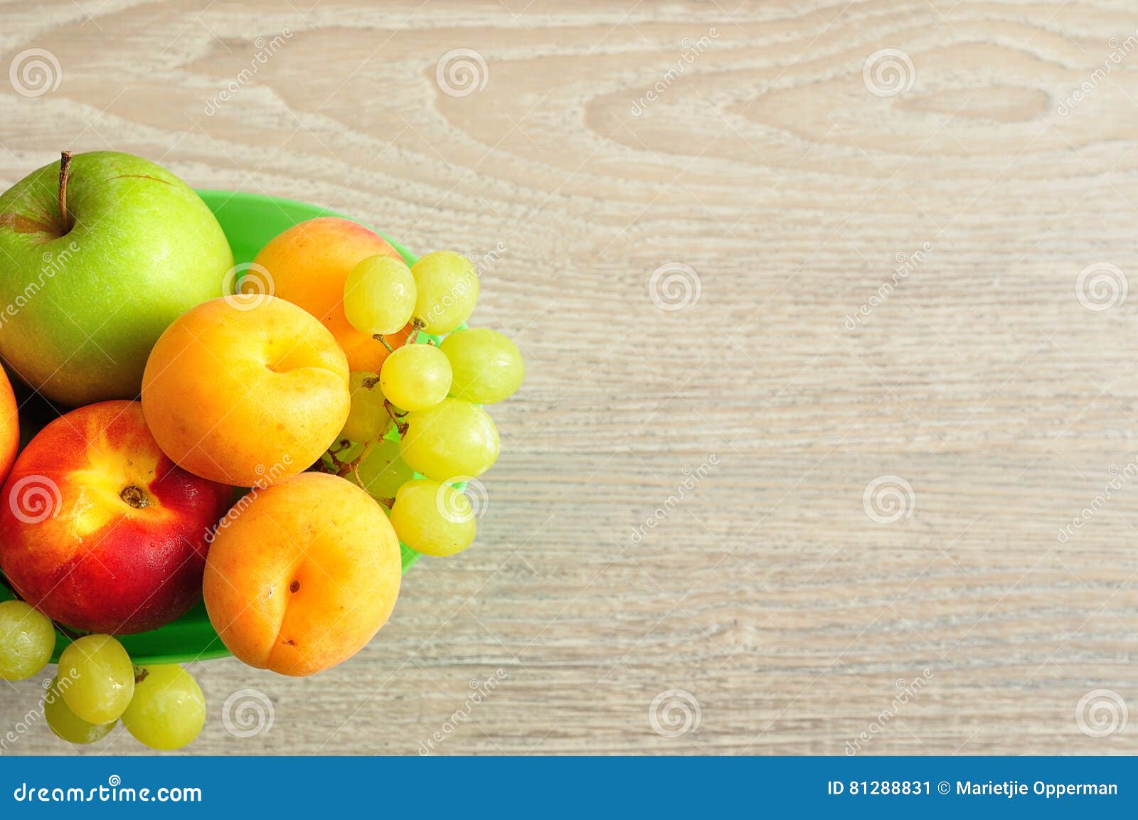 Variety of Fruit in a Green Plastic Bucket Stock Image - Image of ...