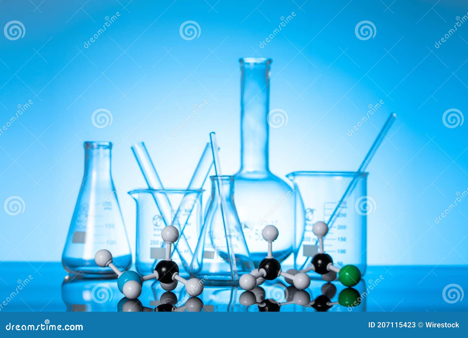 Variety of Glass Flasks and Lab Equipment with Molecule Structures on a ...