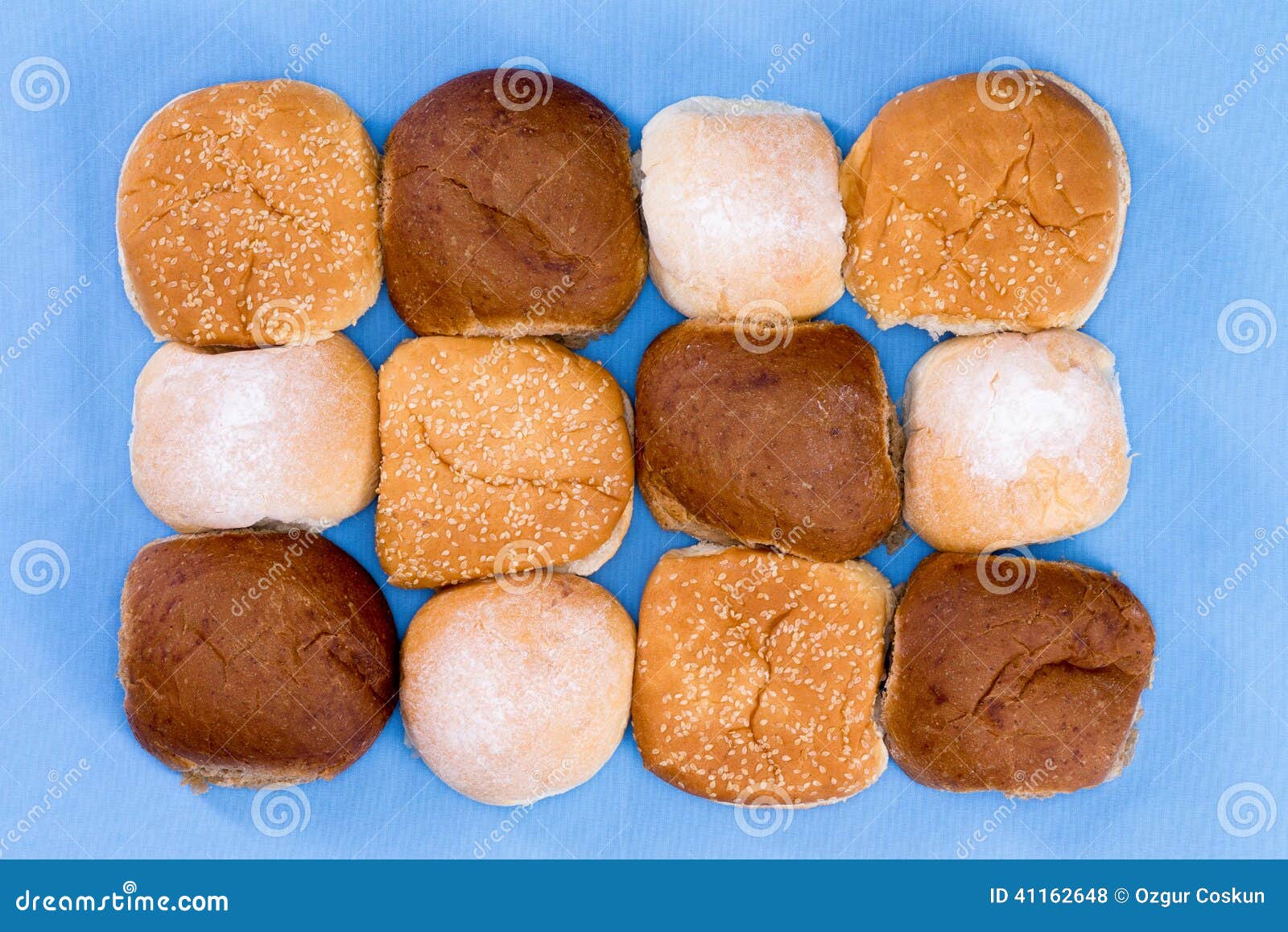 Variety of Hamburger Buns Isolated on Blue Stock Photo - Image of ...