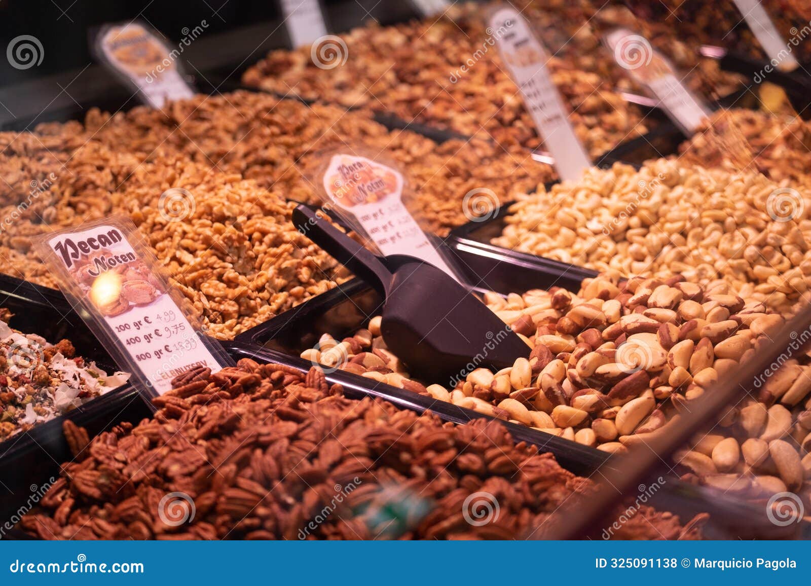 A Variety of Nuts are Displayed in a Store, Including Peanuts, Cashews ...