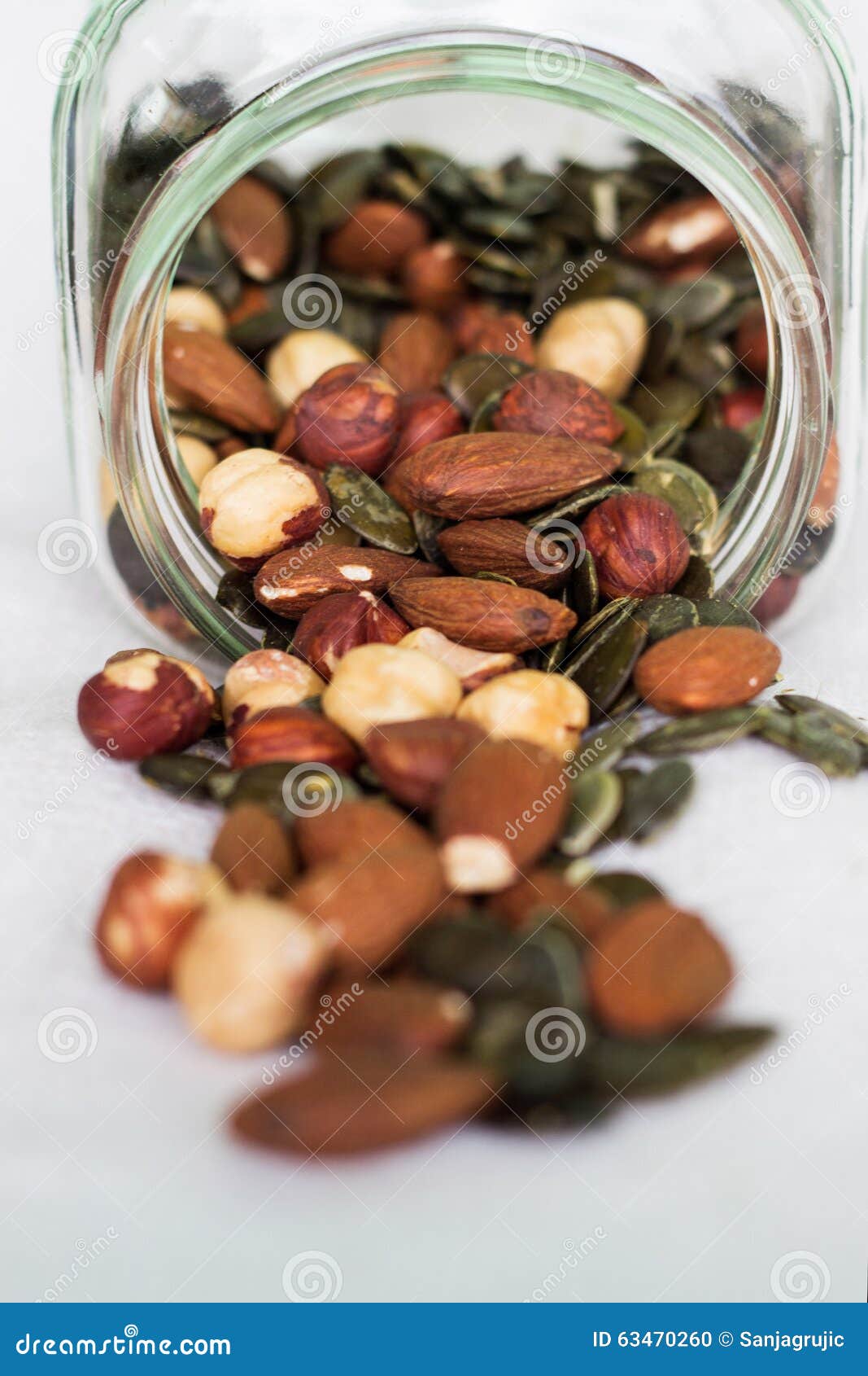 Variety of Nuts Popping Out from Glass Jar Stock Photo - Image of fiber ...
