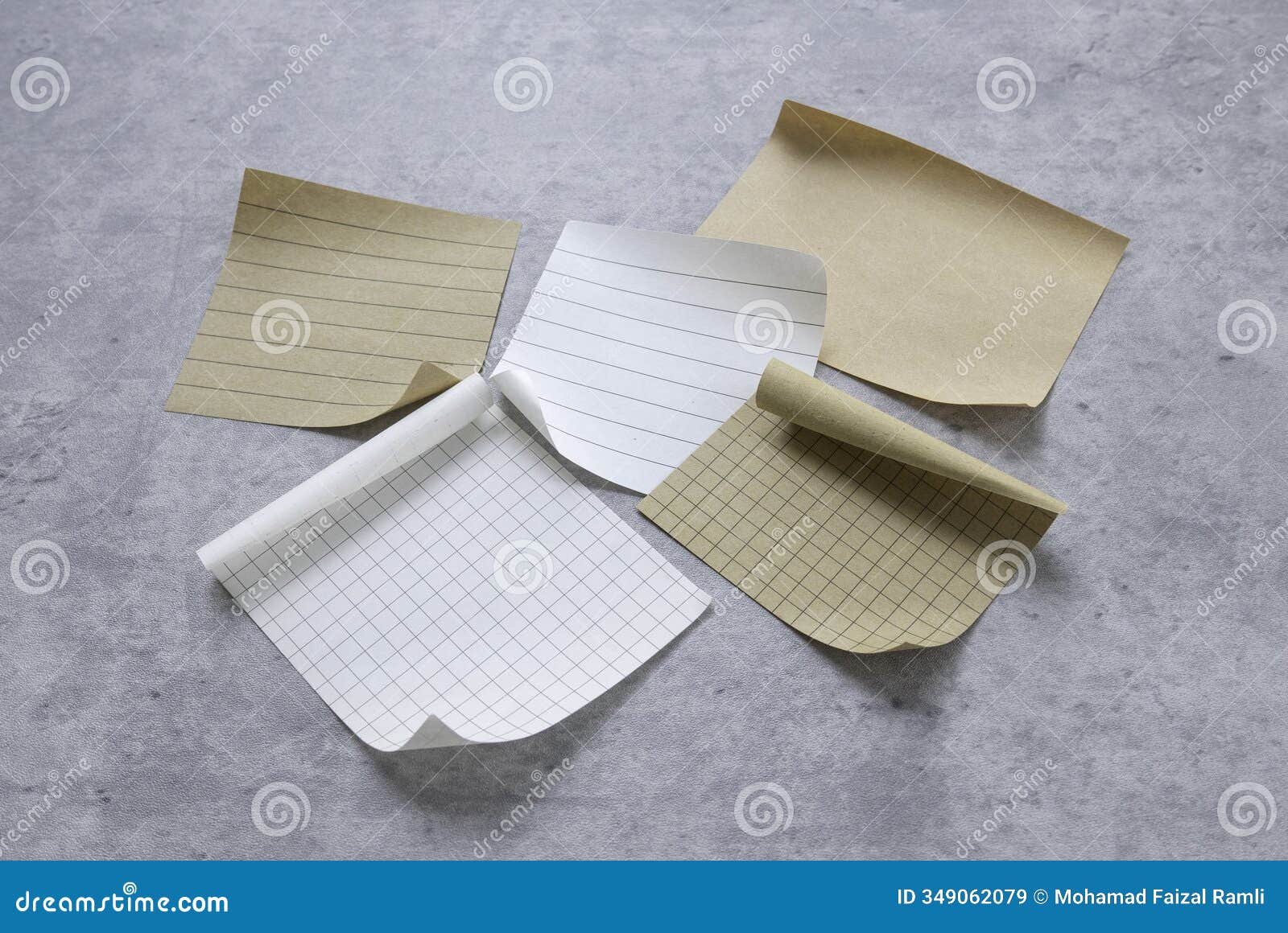 Variety of Paper Types: Lined, Grid, and Plain Sheets on a Gray Surface ...