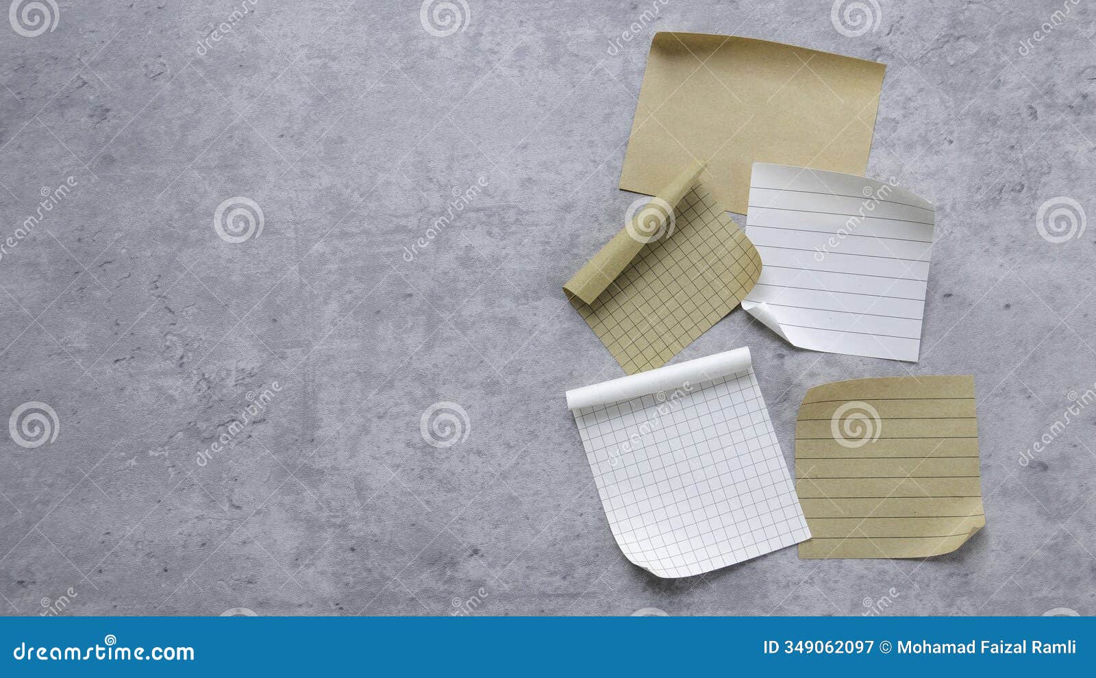 Variety of Paper Types: Lined, Grid, and Plain Sheets on a Gray Surface ...