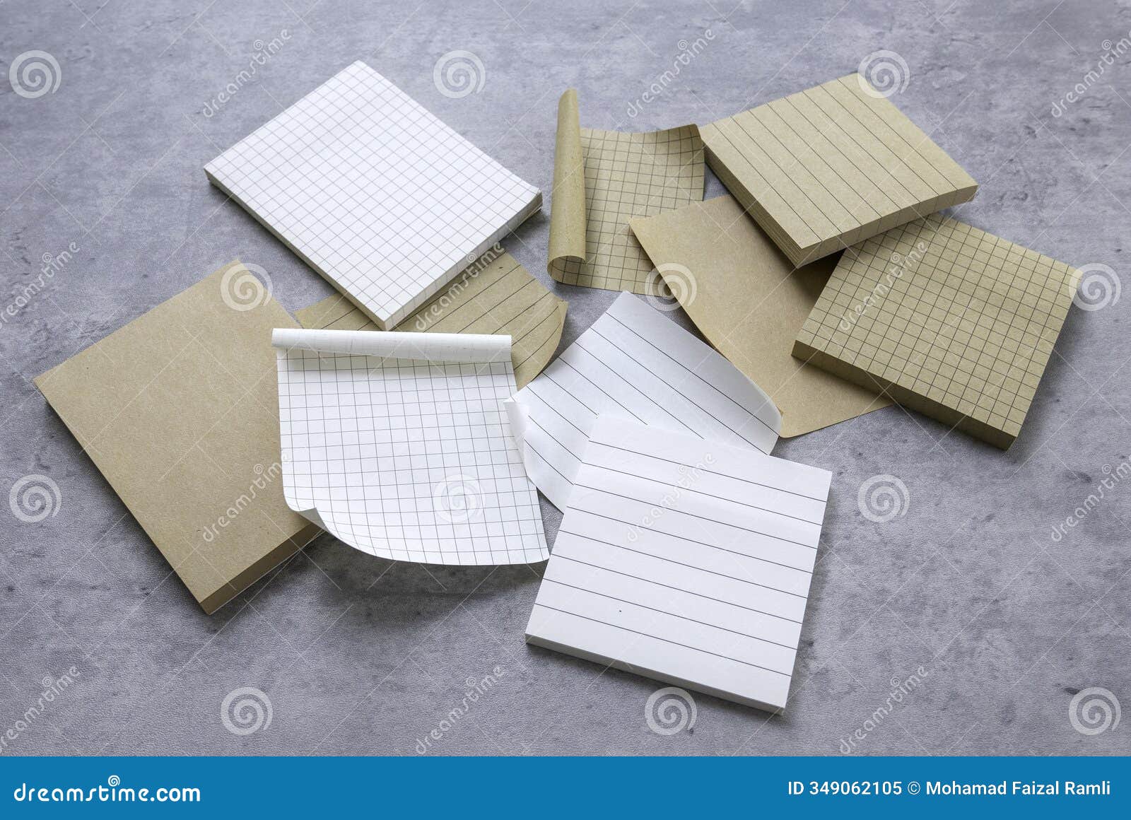 Variety of Paper Types: Lined, Grid, and Plain Sheets on a Gray Surface ...