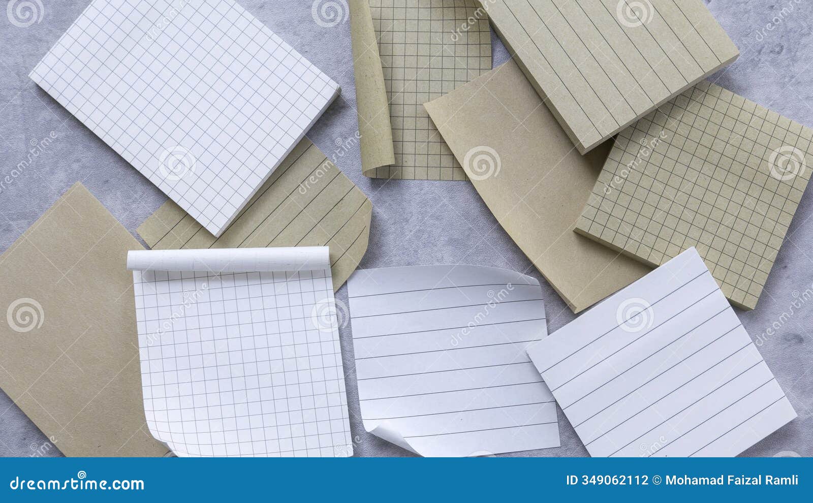 Variety of Paper Types: Lined, Grid, and Plain Sheets on a Gray Surface ...