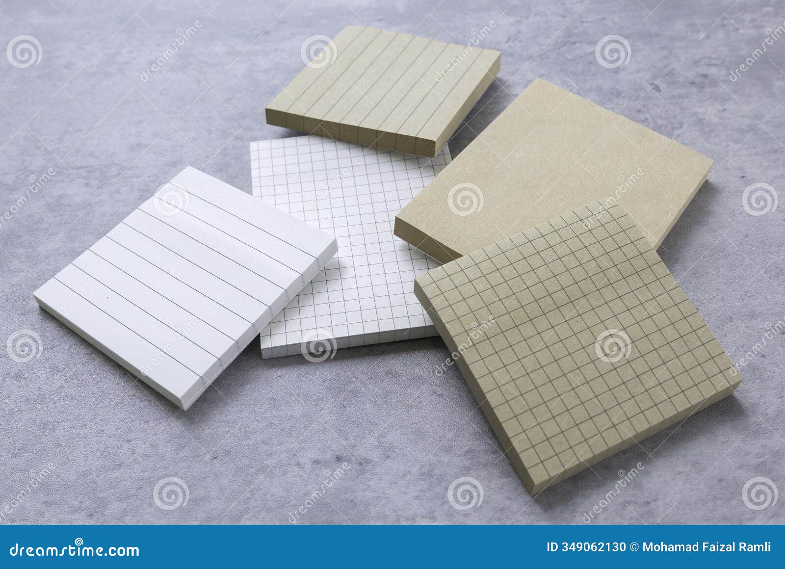 Variety of Paper Types: Lined, Grid, and Plain Sheets on a Gray Surface ...