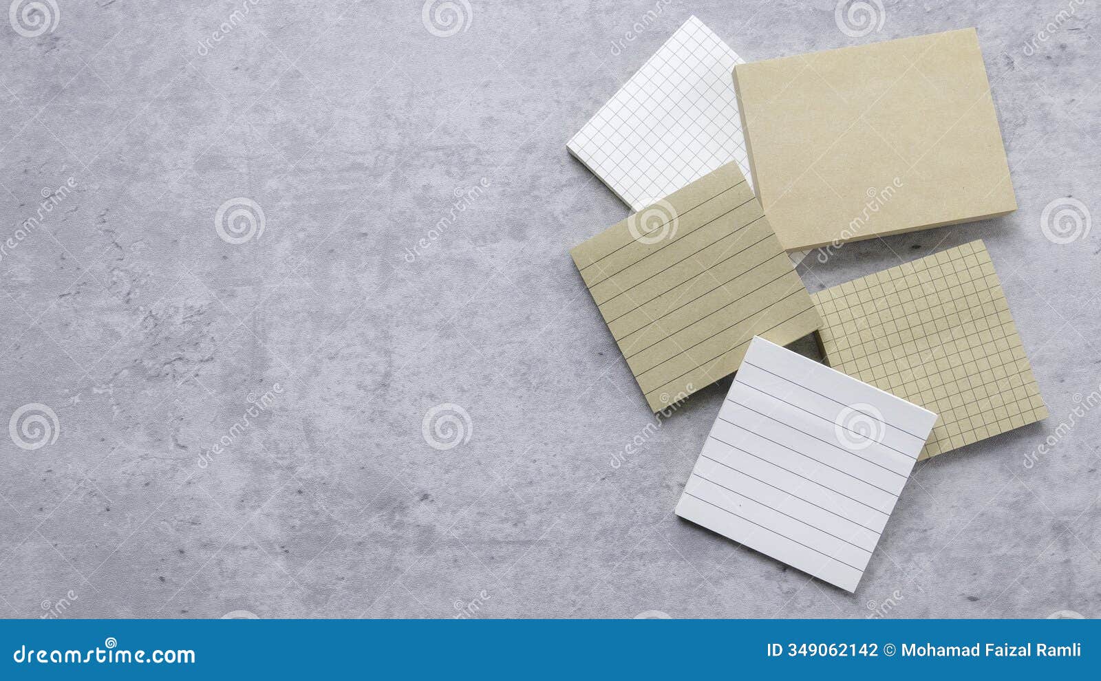 Variety of Paper Types: Lined, Grid, and Plain Sheets on a Gray Surface ...