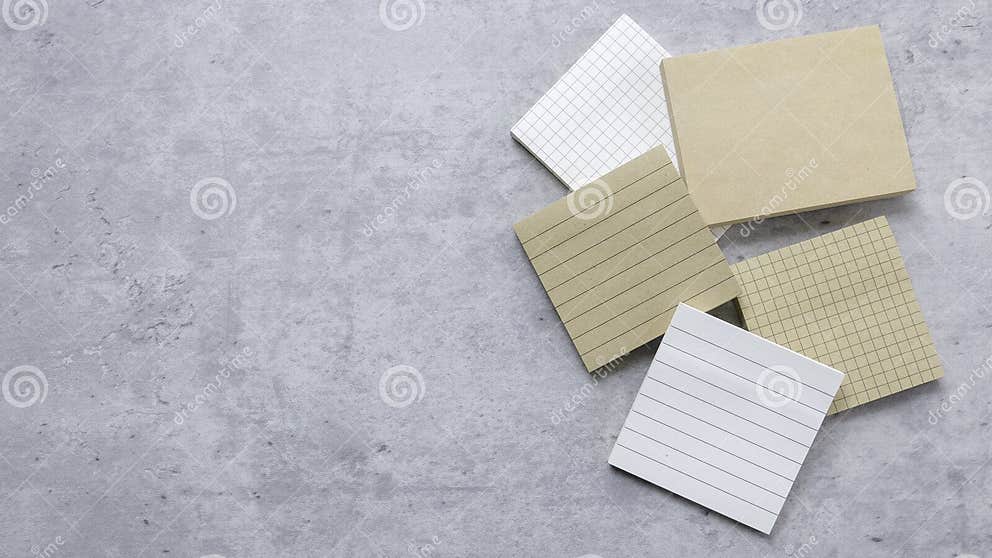Variety of Paper Types: Lined, Grid, and Plain Sheets on a Gray Surface ...