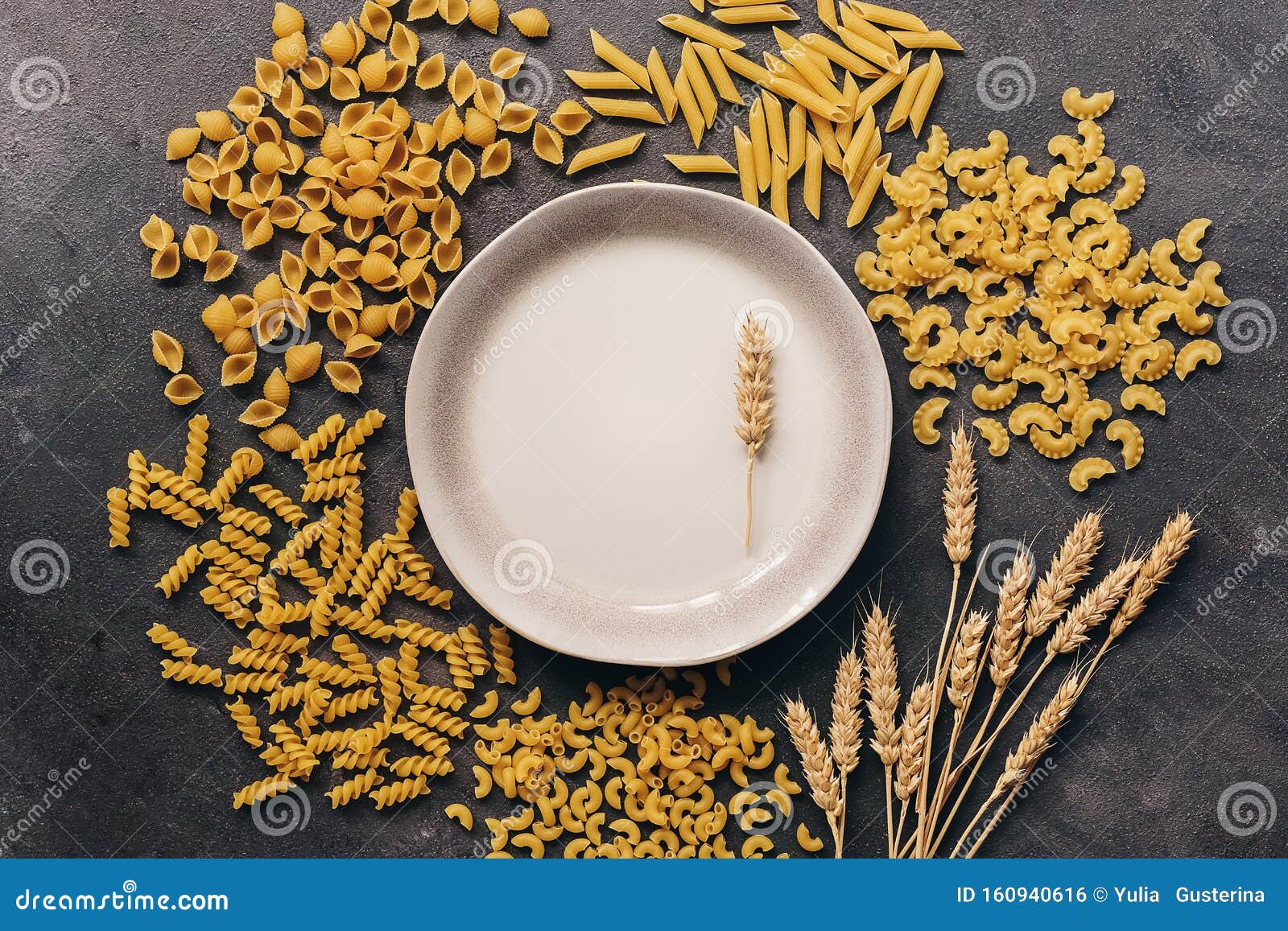 A Variety of Pasta and Empty Plate on a Dark Rustic Background. Flat ...