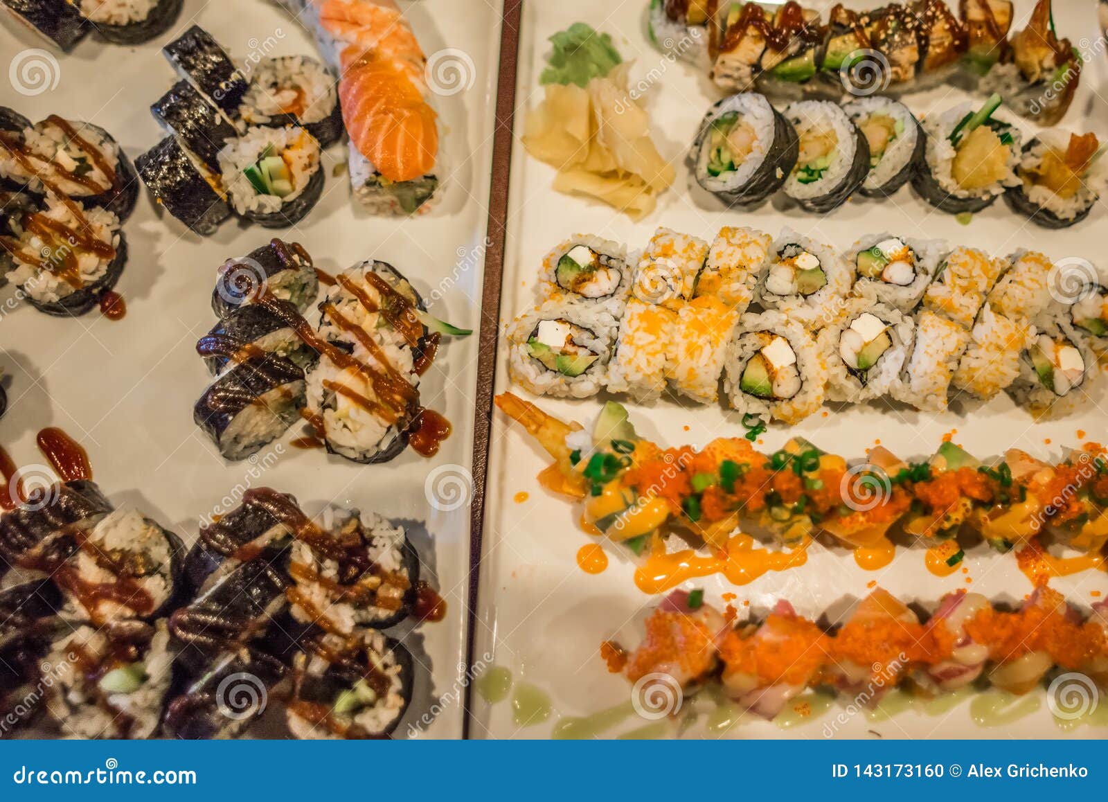 Variety of Sushi Rolls on a Dinner Table Stock Photo - Image of limon ...