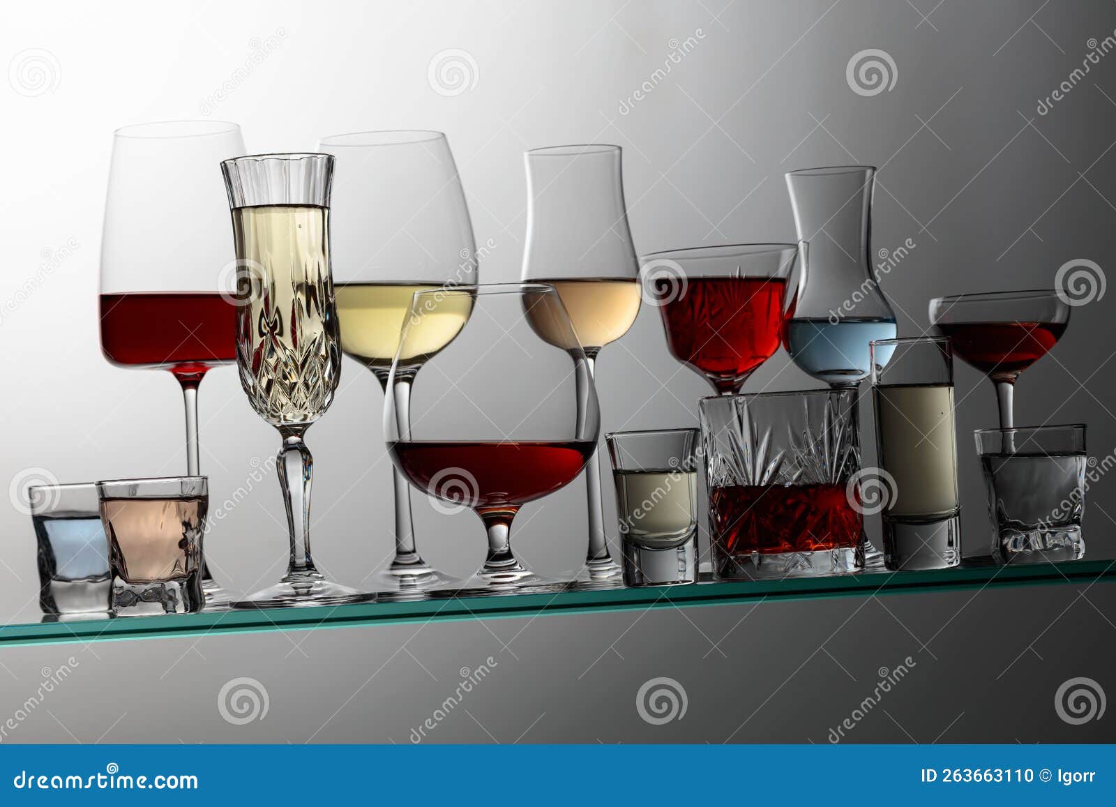 Alcoholic Drinks on a Tilted Glass Shelf Stock Photo - Image of ...