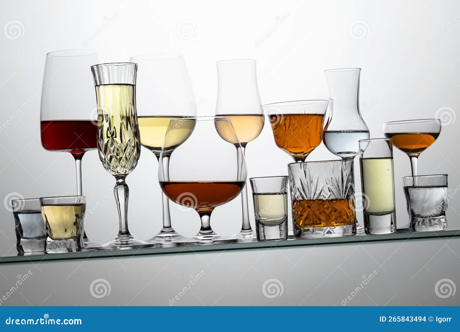 Alcoholic Drinks on a Tilted Glass Shelf Stock Photo - Image of ...