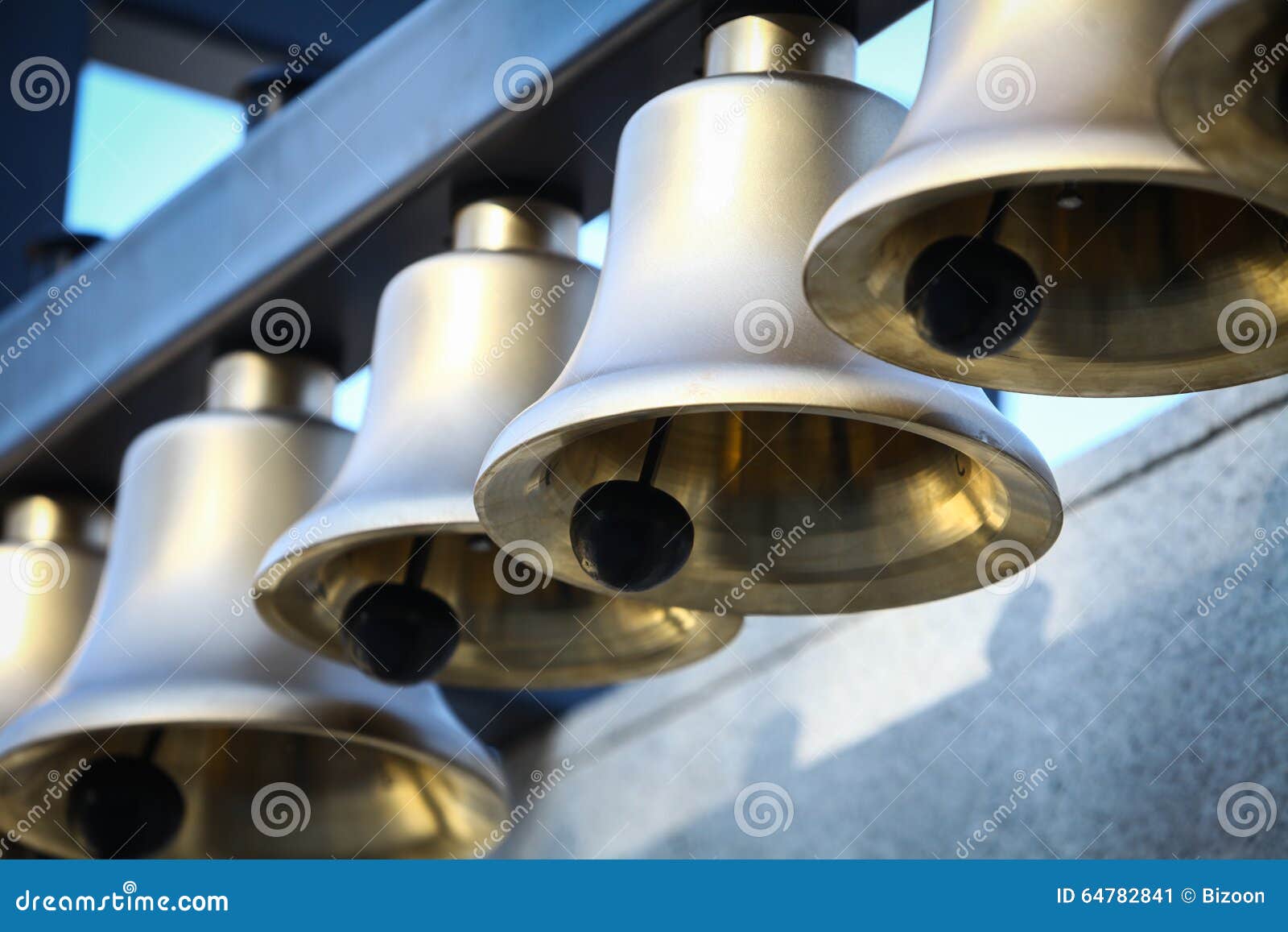 Various bells in a row stock image. Image of iron, golden - 64782841
