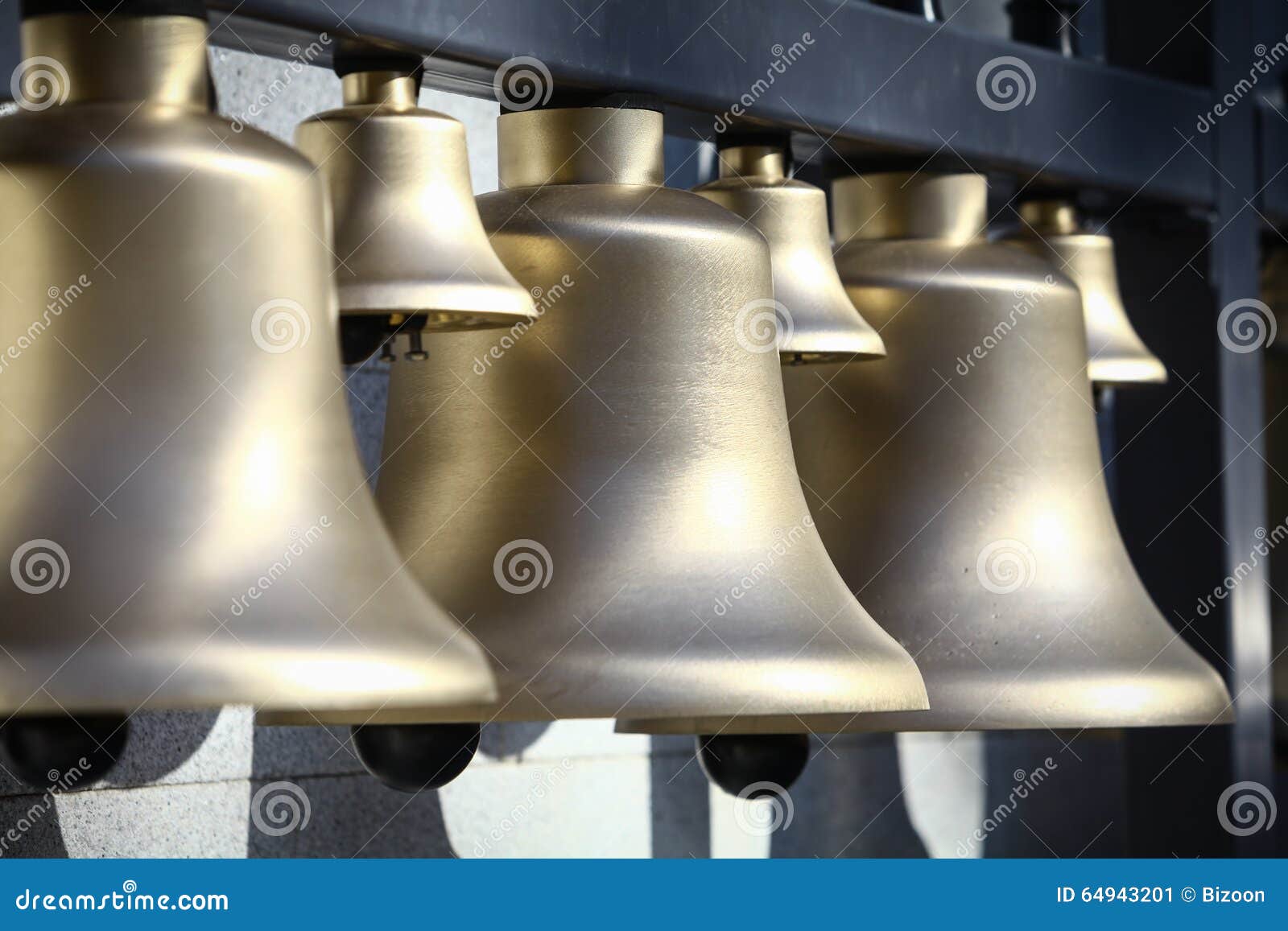 Various bells in a row stock image. Image of metal, brass - 64943201