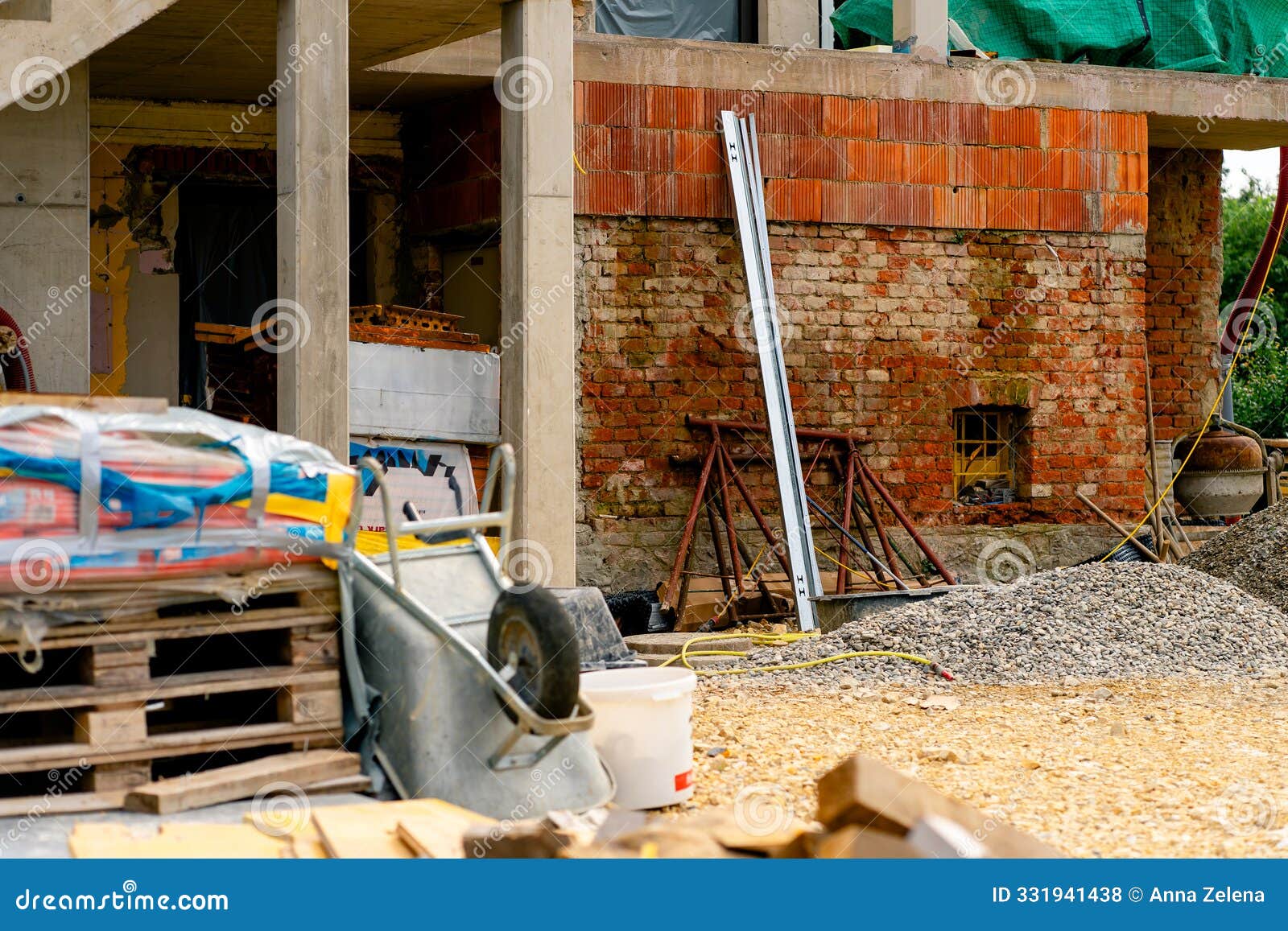 Various Building Materials and Fixtures Near a House Under Construction ...