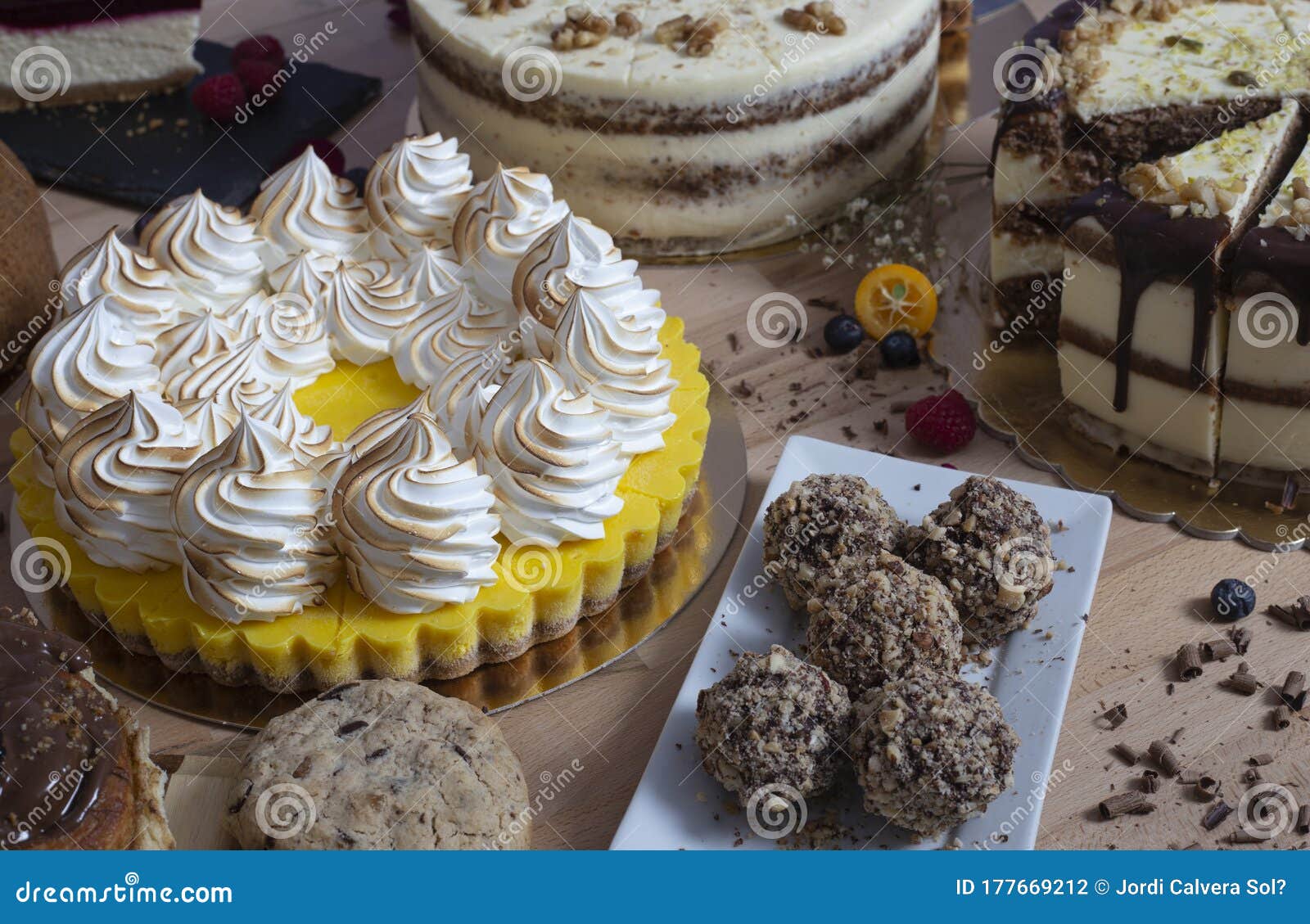 Various Cakes on Wooden Table. Assortment of Cakes for Celebrations ...