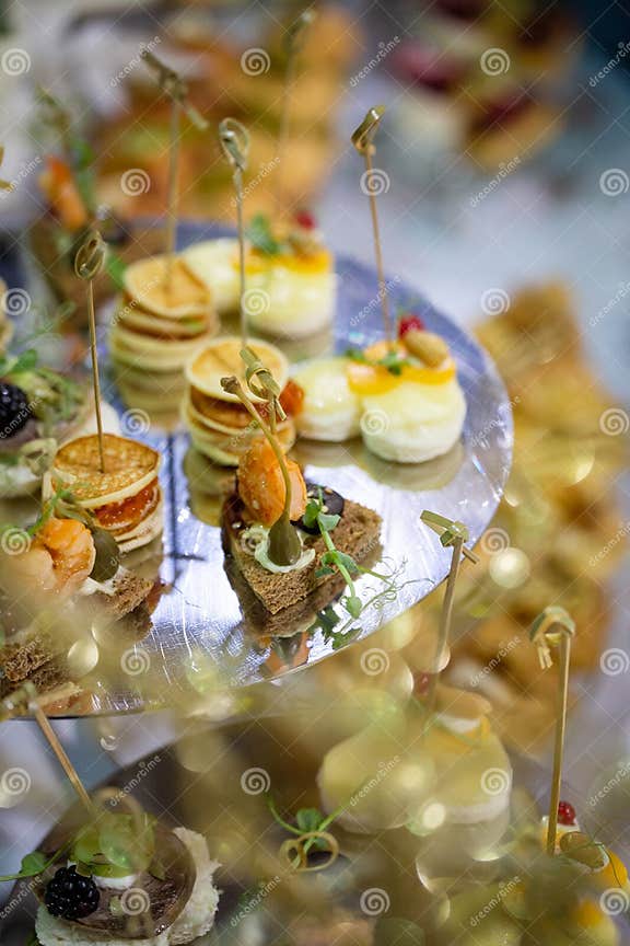 Various Canapes and Drinks on the Buffet Table on a Stand Stock Photo ...