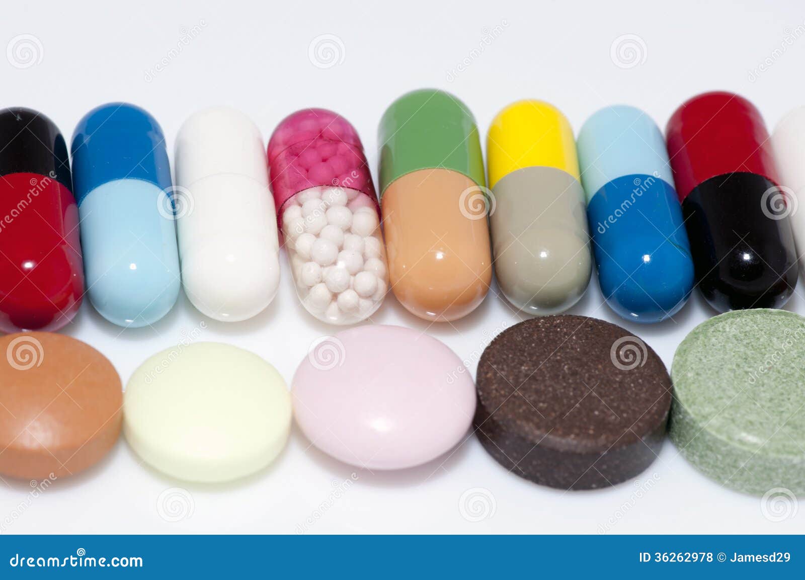 Various Capsules and Tablets in Row Stock Photo - Image of tablet ...